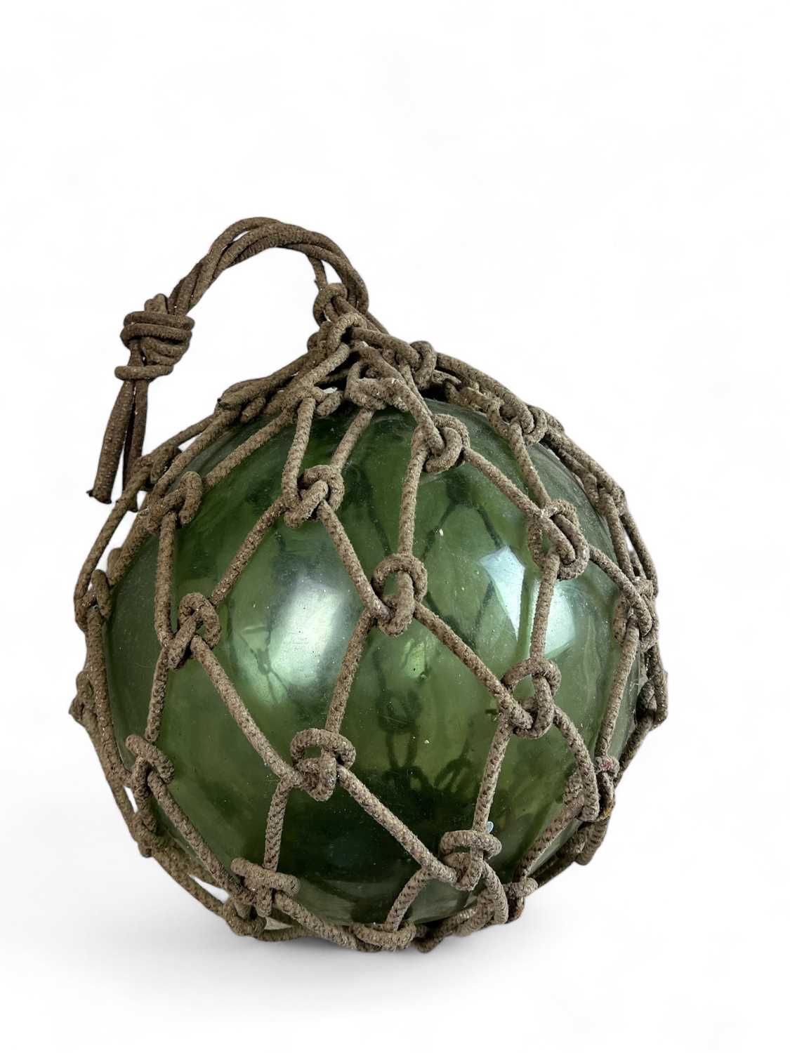 Lot 1184 - A huge blown green glass float