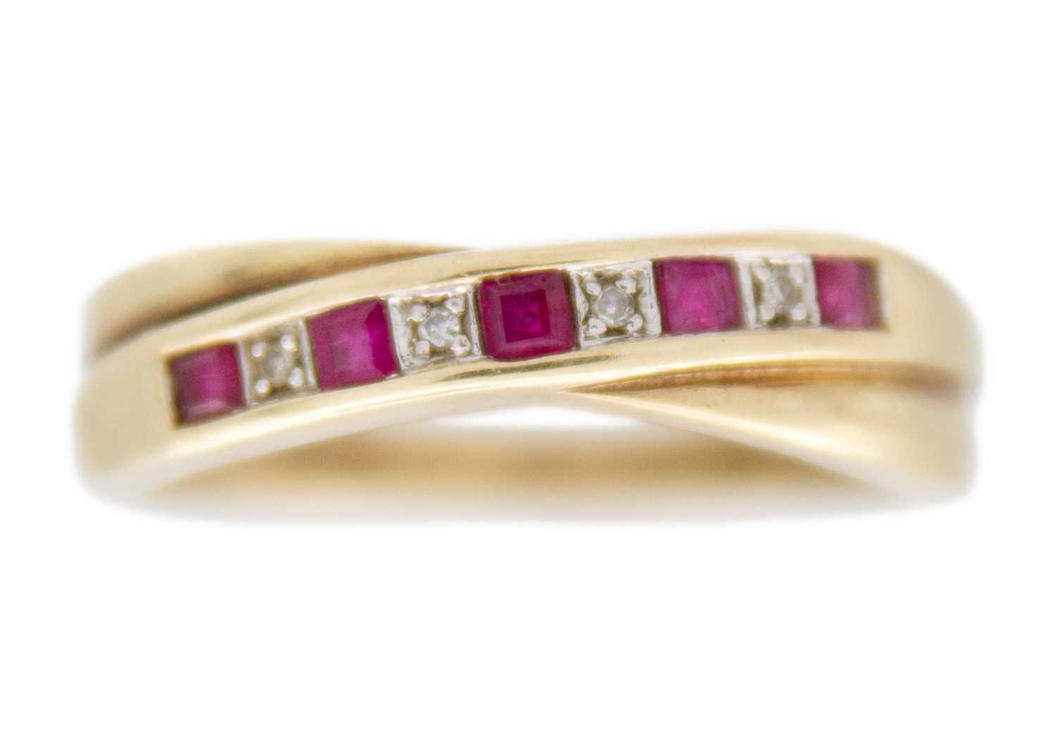 Lot 219 - A 9ct yellow gold ruby and diamond crossover
