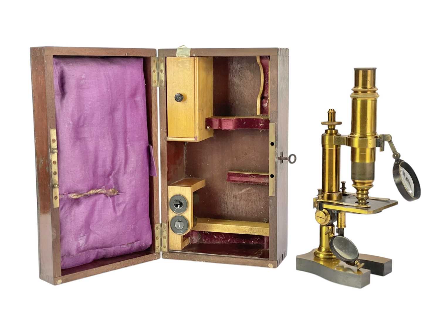 Lot 156 - A French lacquered brass microscope by