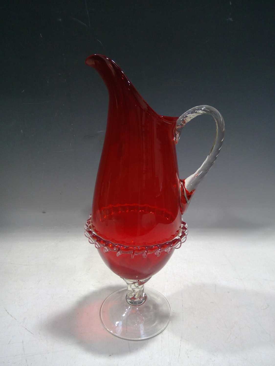 Lot 54 - A Ruby Red Pitcher. The Pitcher is 33cm tall.