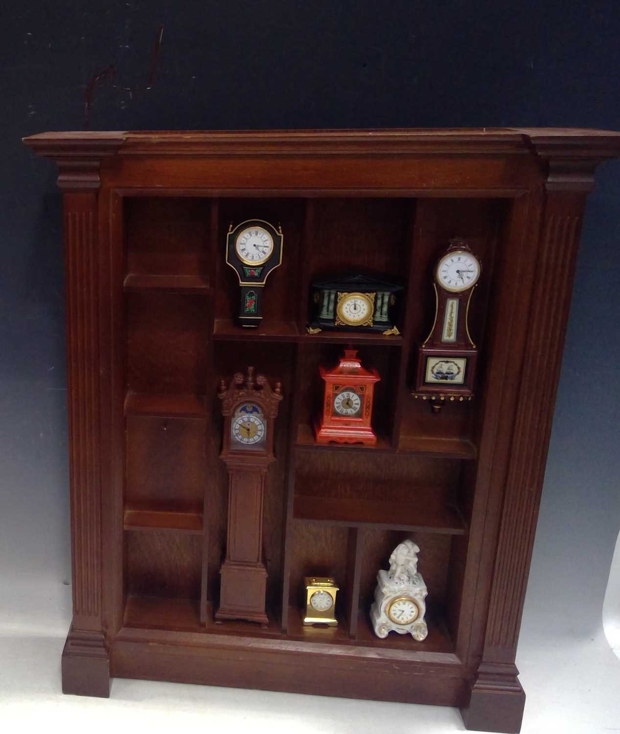 Lot 223 - A Franklin Mint Clock Stand and Seven Clocks.