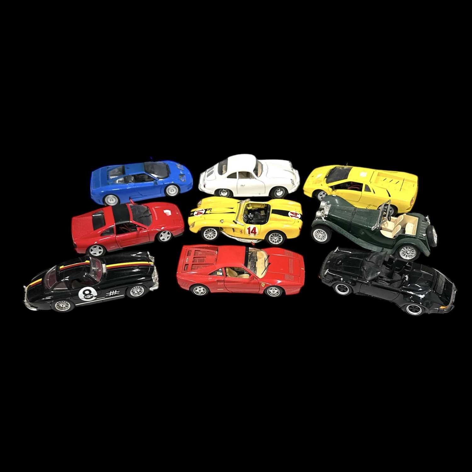 Lot 102 - Nine 1/18th scale cast metal model cars.