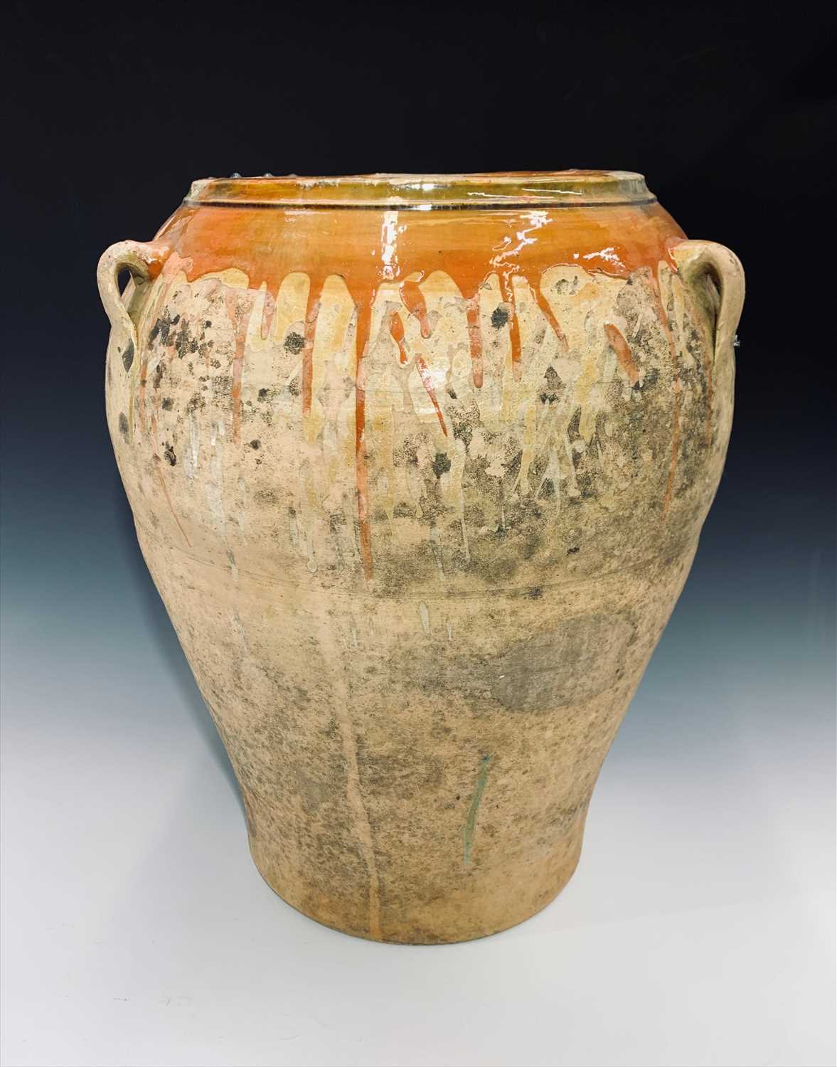 Lot 240 - A large terracotta olive jar with three loop
