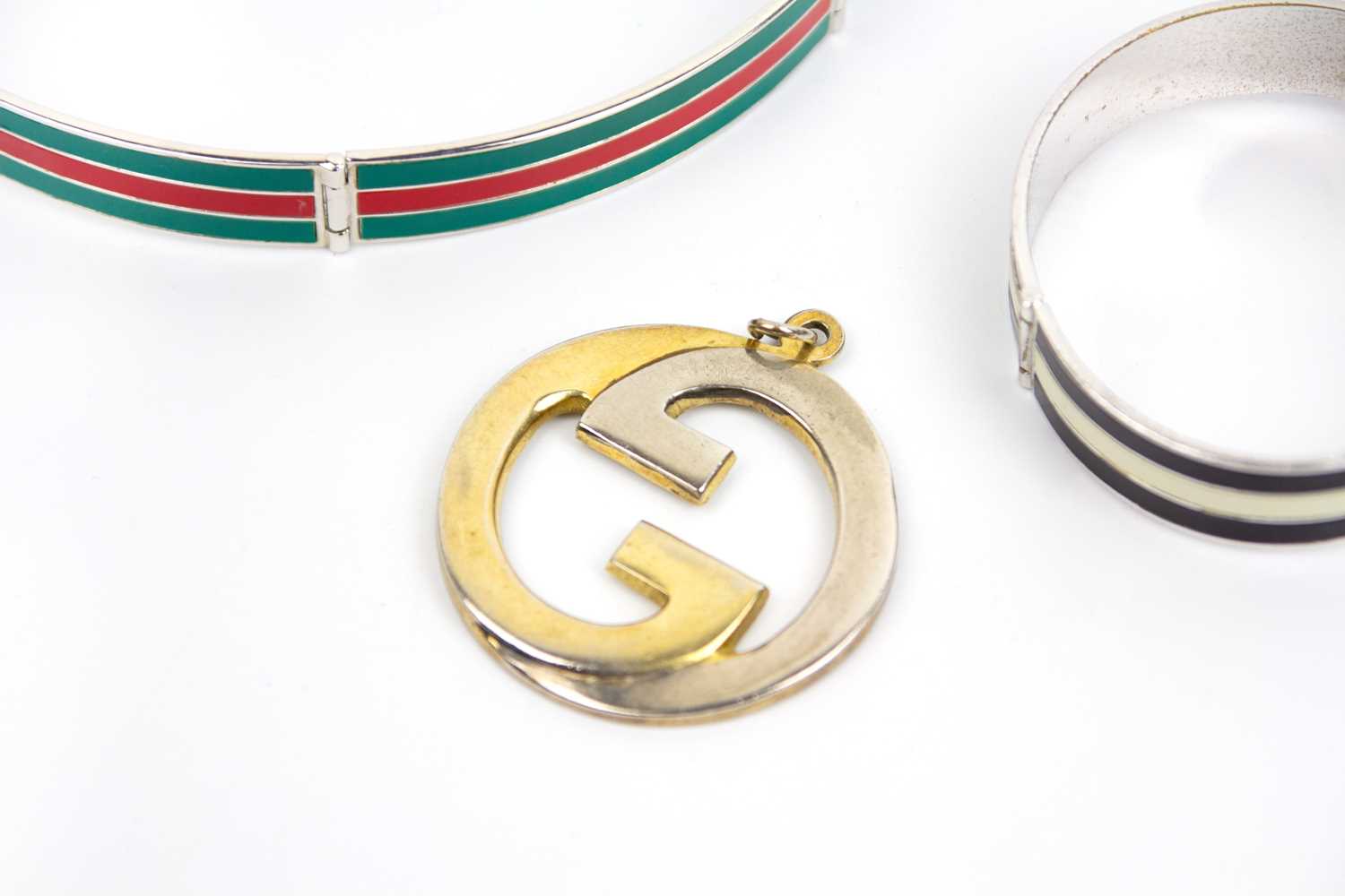 Lot 271 - GUCCI - A chrome plated and enamel belt form