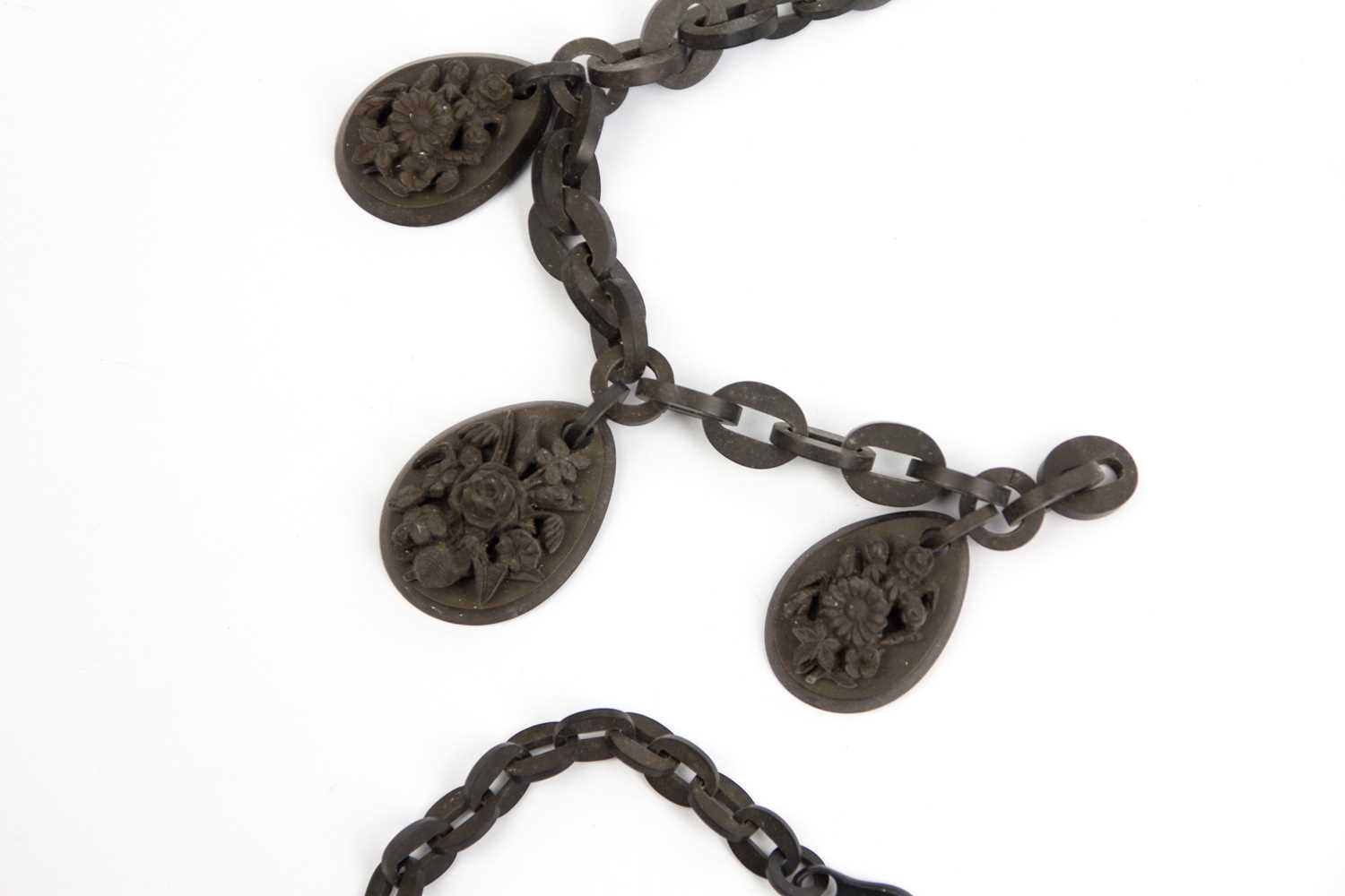 Lot 296 - A Victorian Whitby jet necklace with three