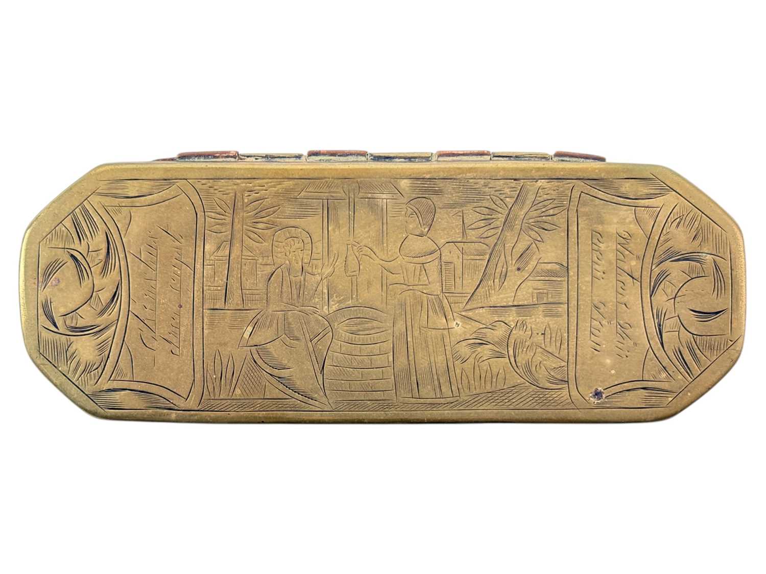 Lot 144 - A Dutch copper and brass snuff box.