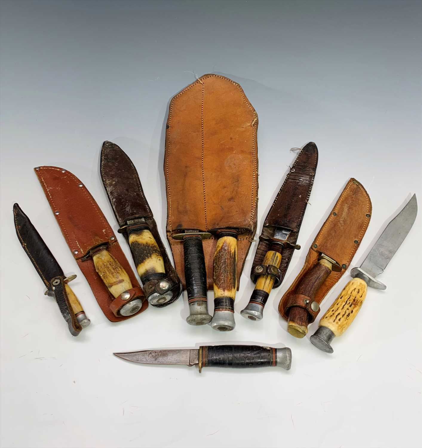 Lot 203 - A collection of nine sheath knives, mainly