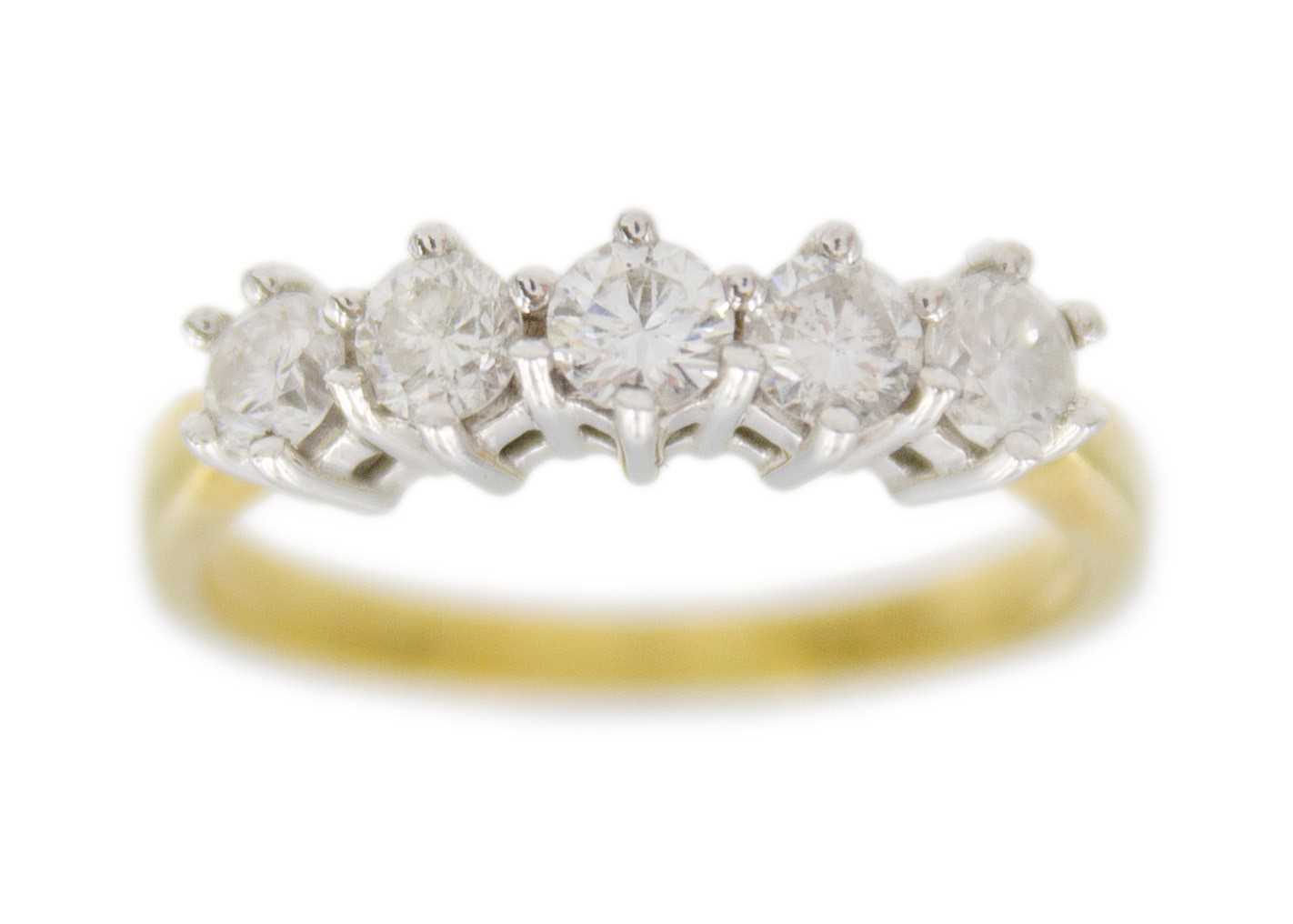 Lot 169 - An 18k gold five-stone diamond set ring.