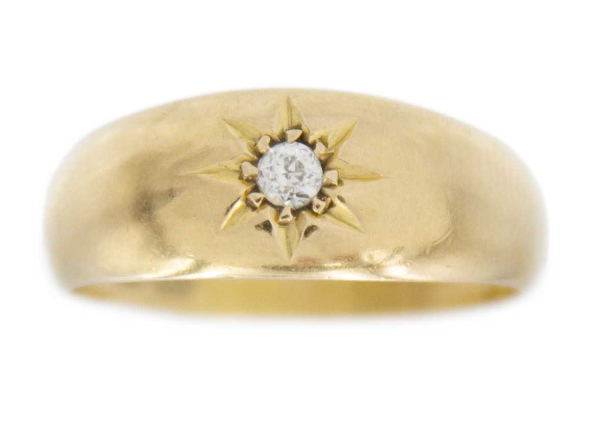 Lot 154 - An 18k gold diamond set gypsy-style ring.