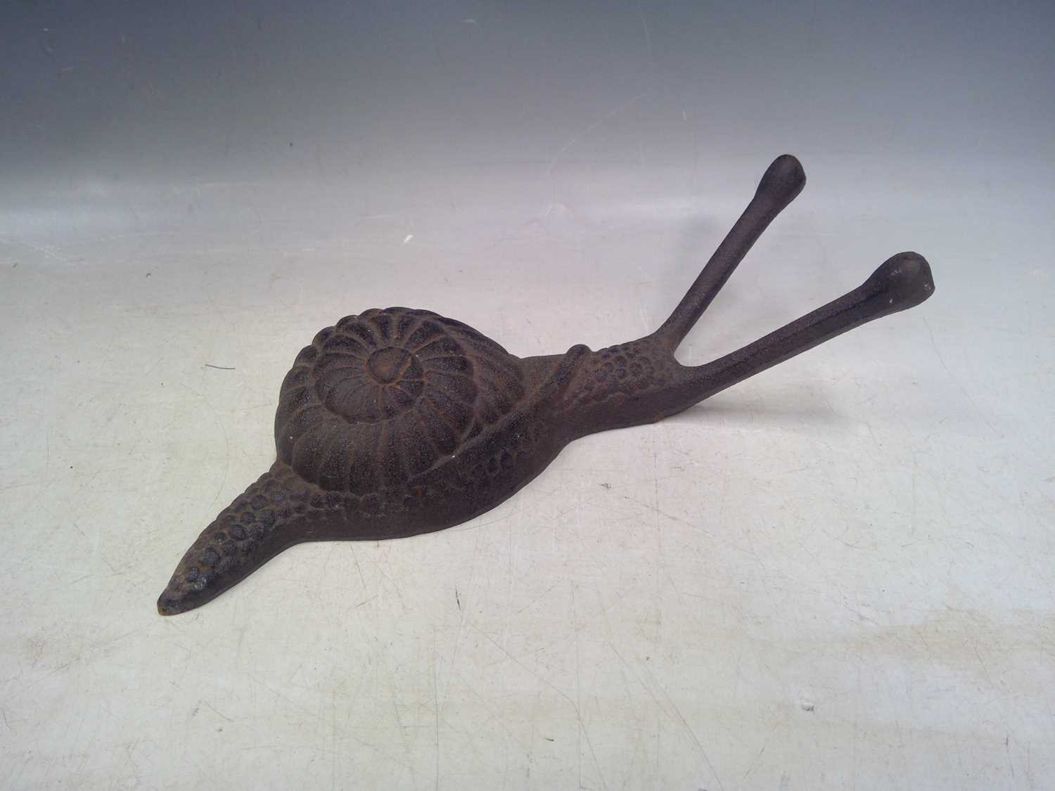 Lot 239 - A Cast Iron Snail. The Snail is 24cm long