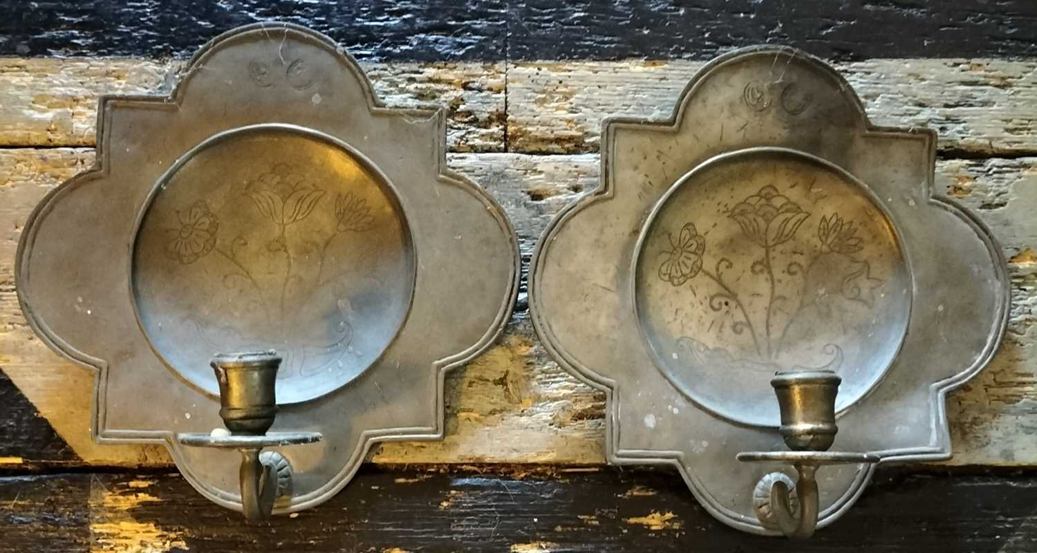 Lot 72 - A pair of pewter candle wall sconces.
