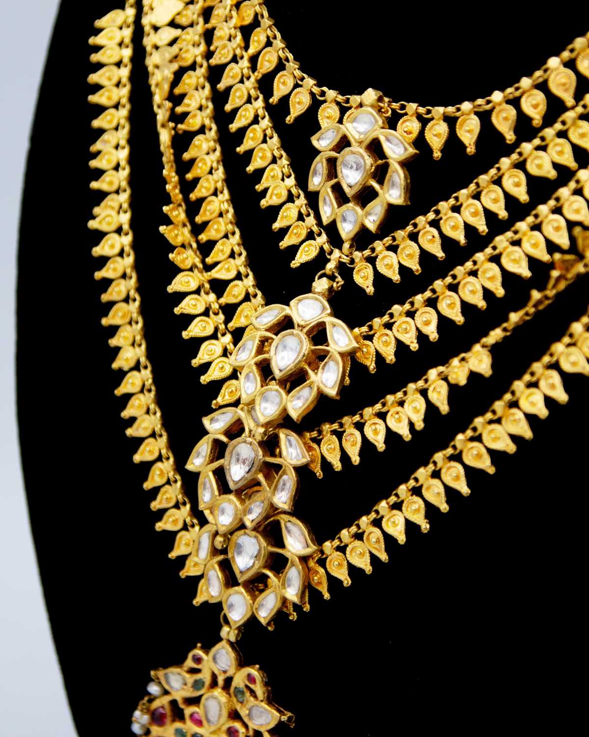 A traditional Indian 22k gold rani haar five-row