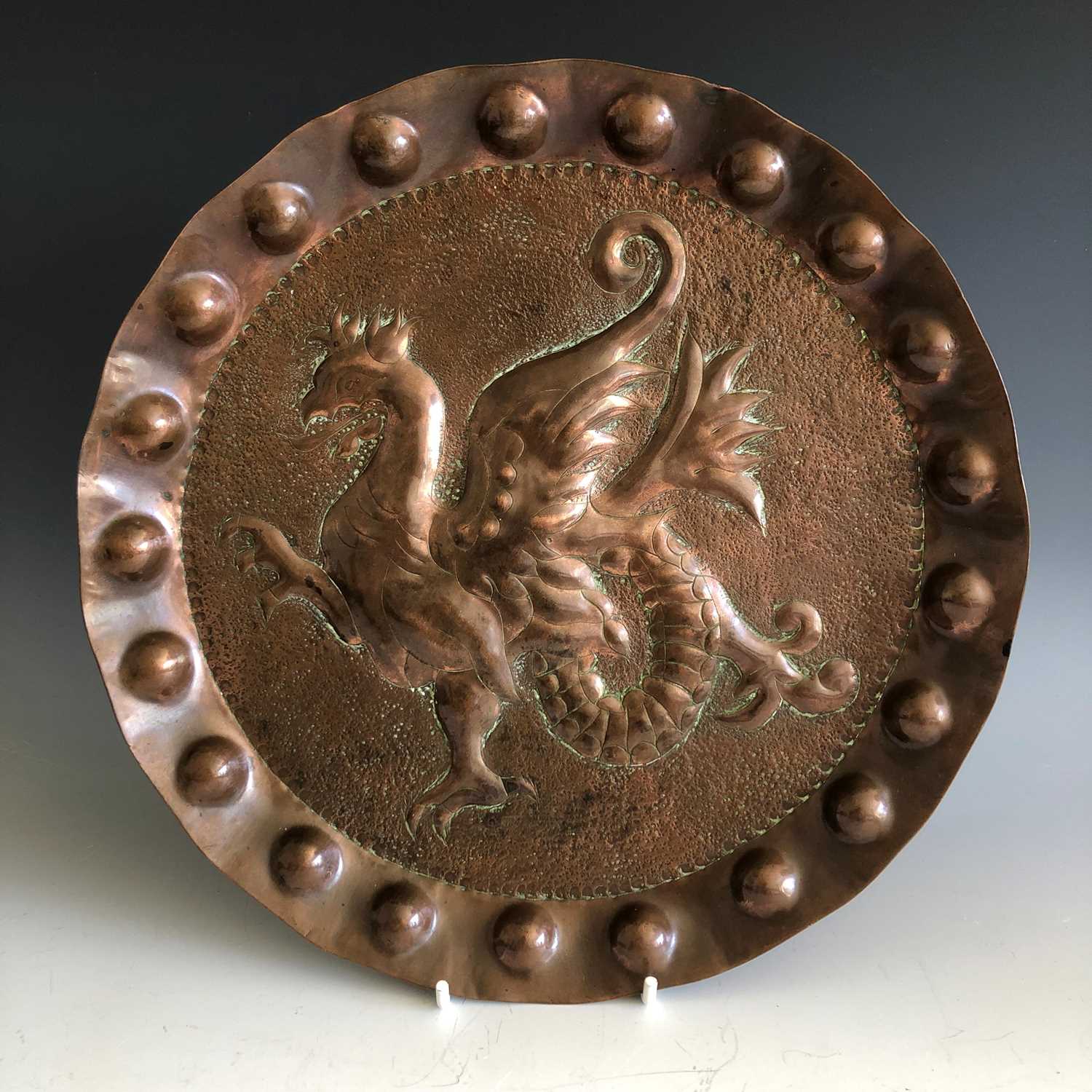 Lot 327 - A Cornish art copper charger of circular
