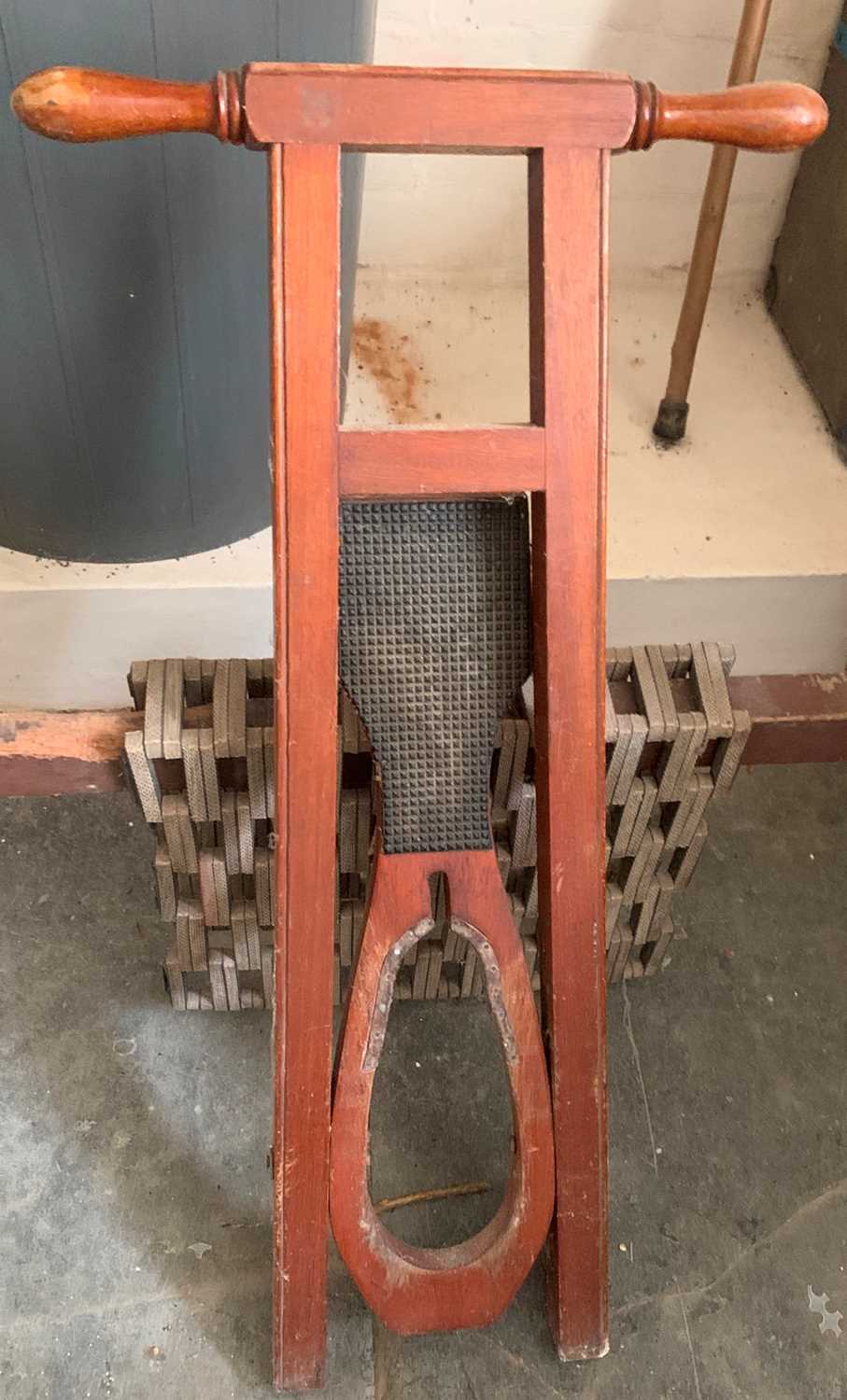 Lot 172 - A Victorian stained pine folding boot pull.