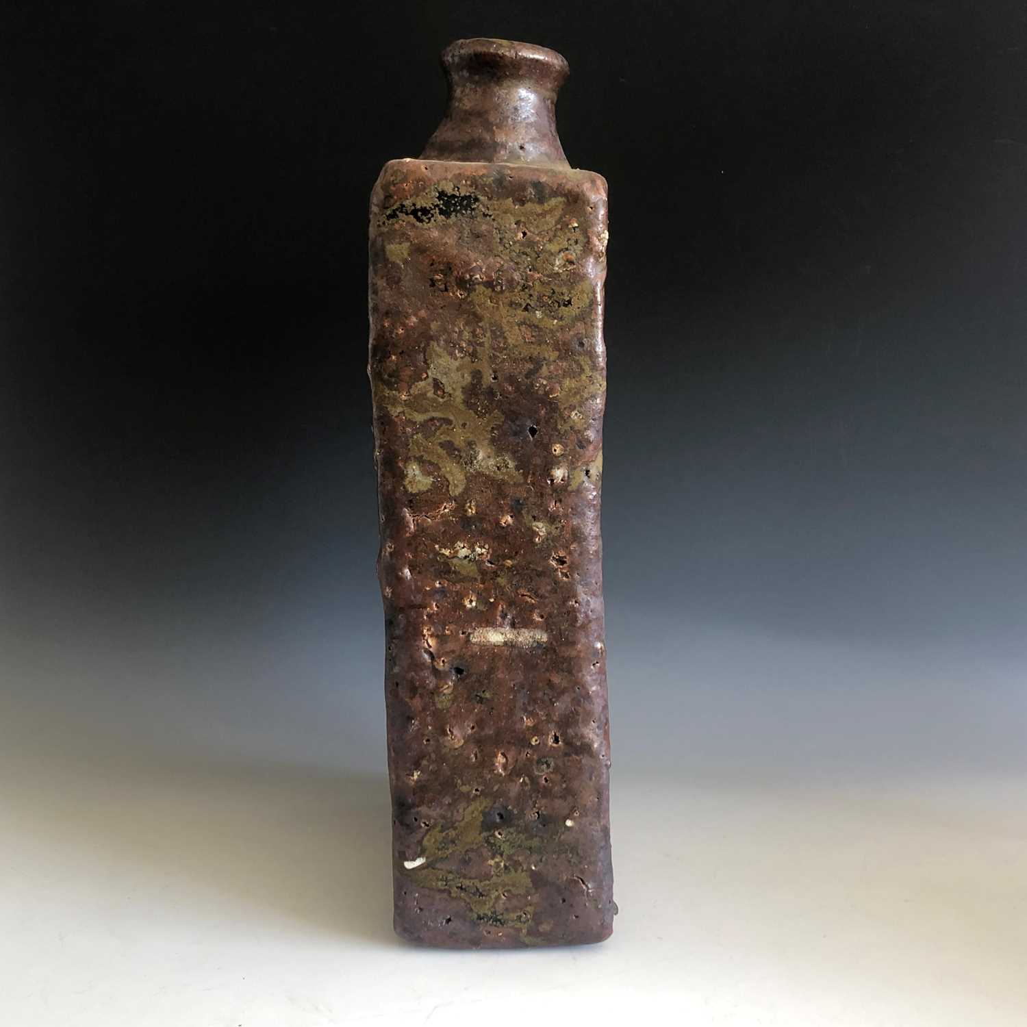 Lot 525 - A textured studio pottery slab bottle vase,