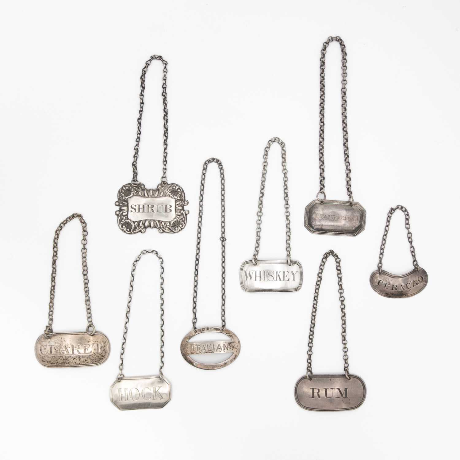 Lot 145 - A selection of eight silver wine labels.