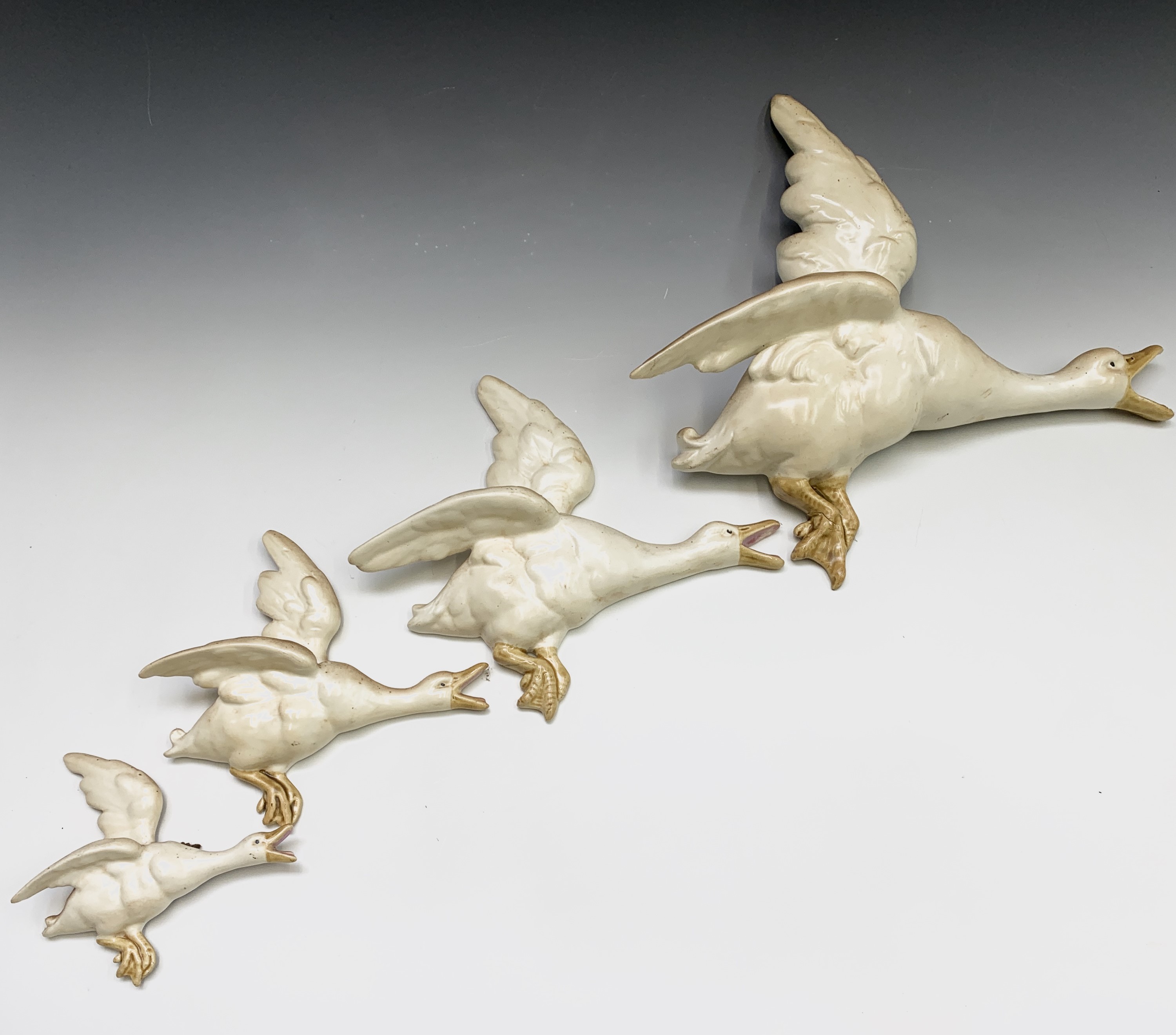 Lot 803 - A set of four Royal Dux flying geese,