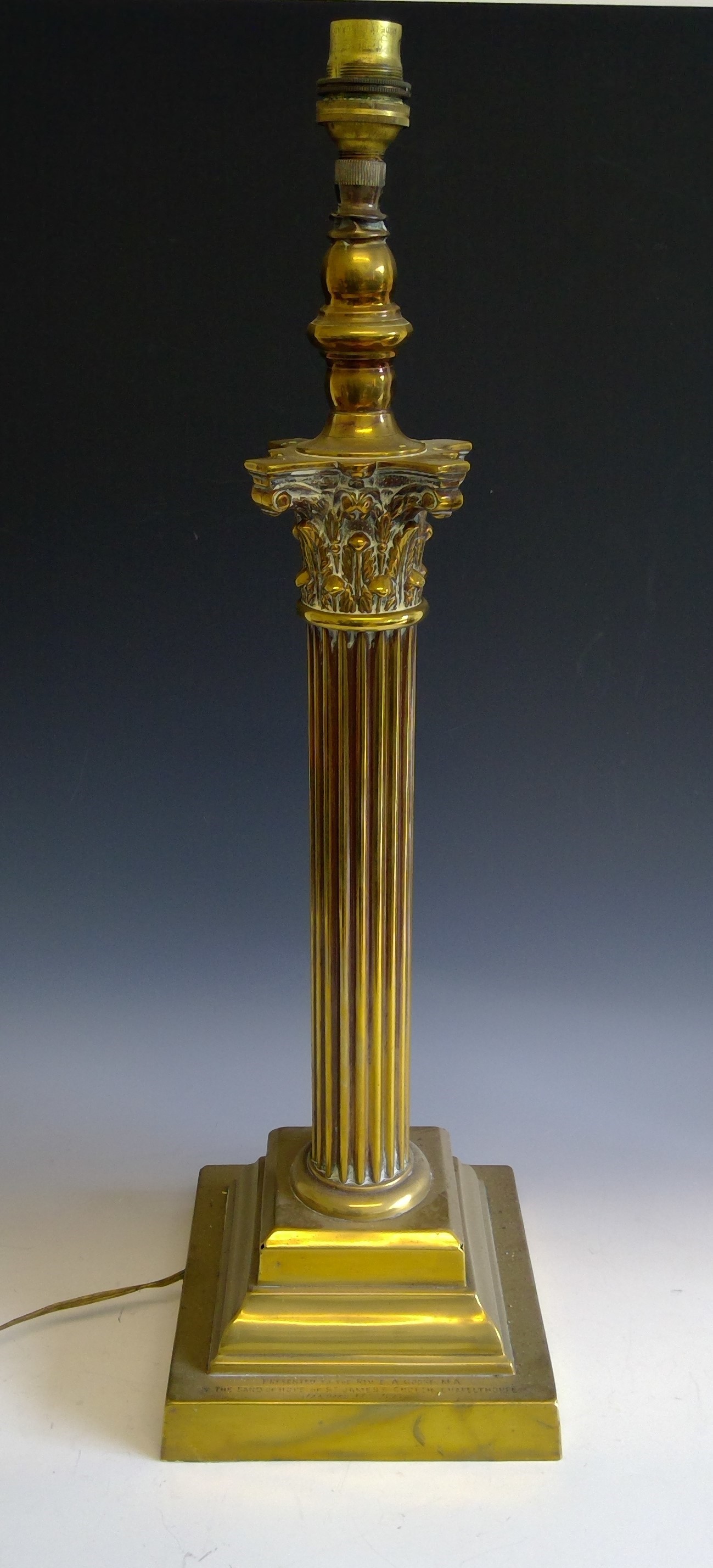 Lot 235 - A brass corinthian column lamp base, bearing