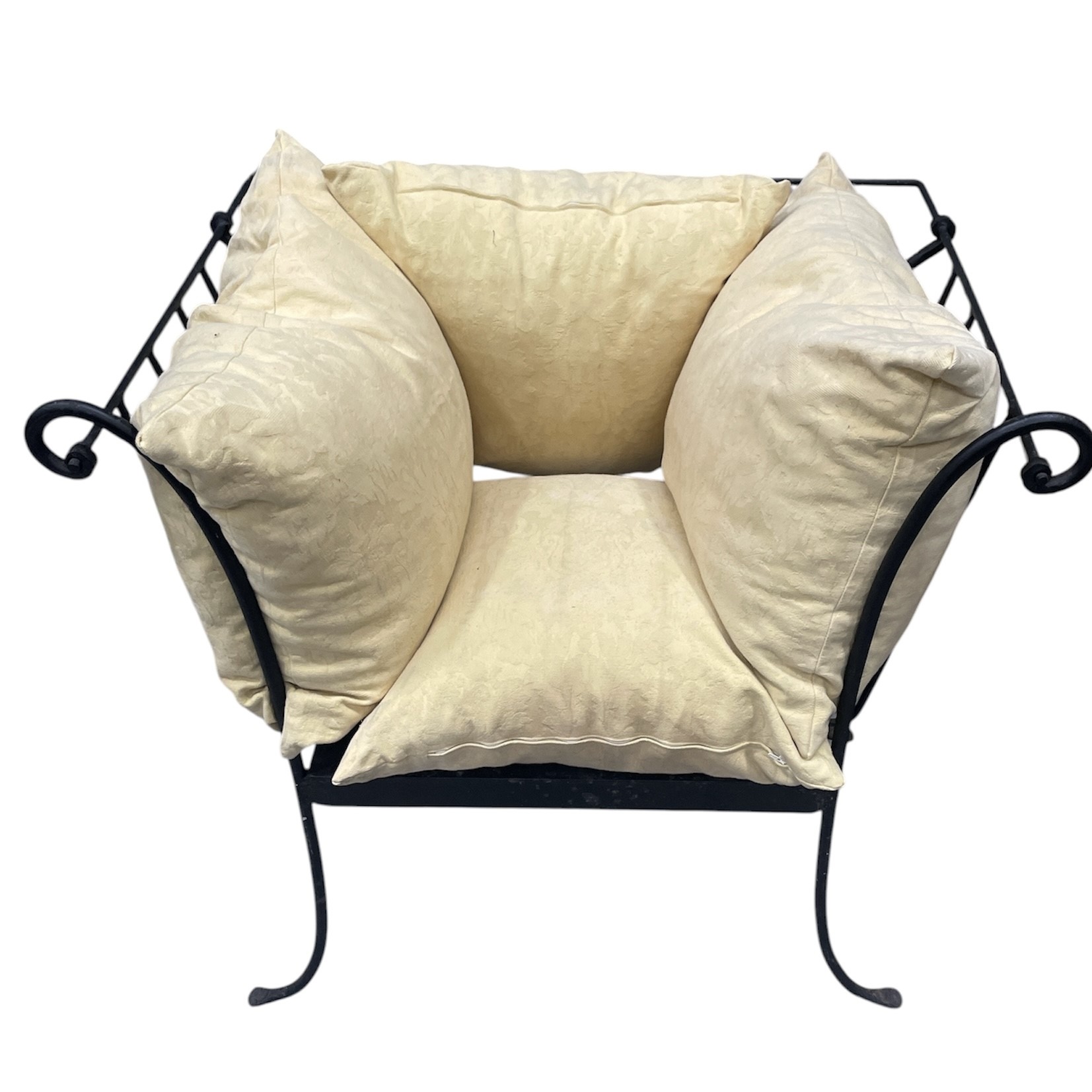Lot 180 - A wrought iron chair with loose cushions.