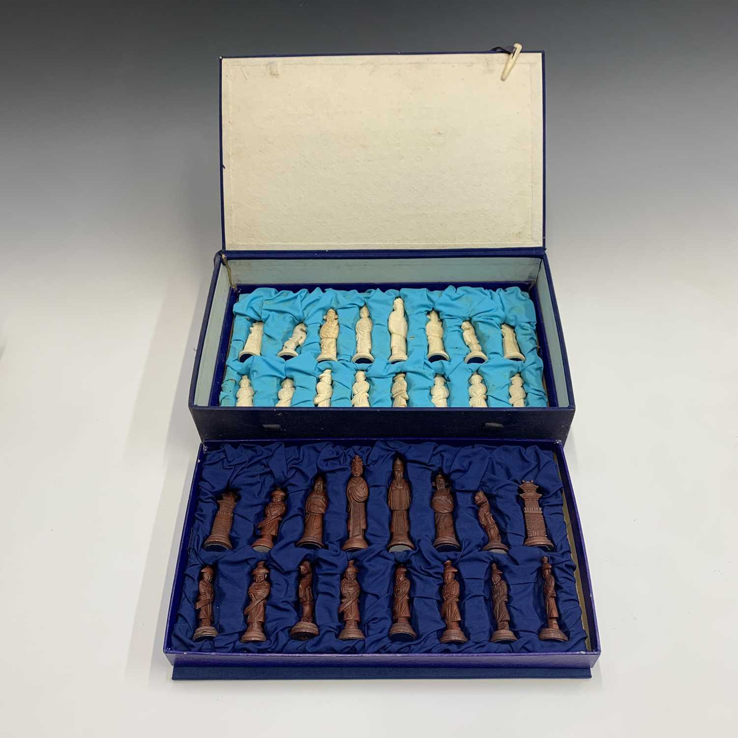 Lot 257 - A Chinese bone and red stained composition