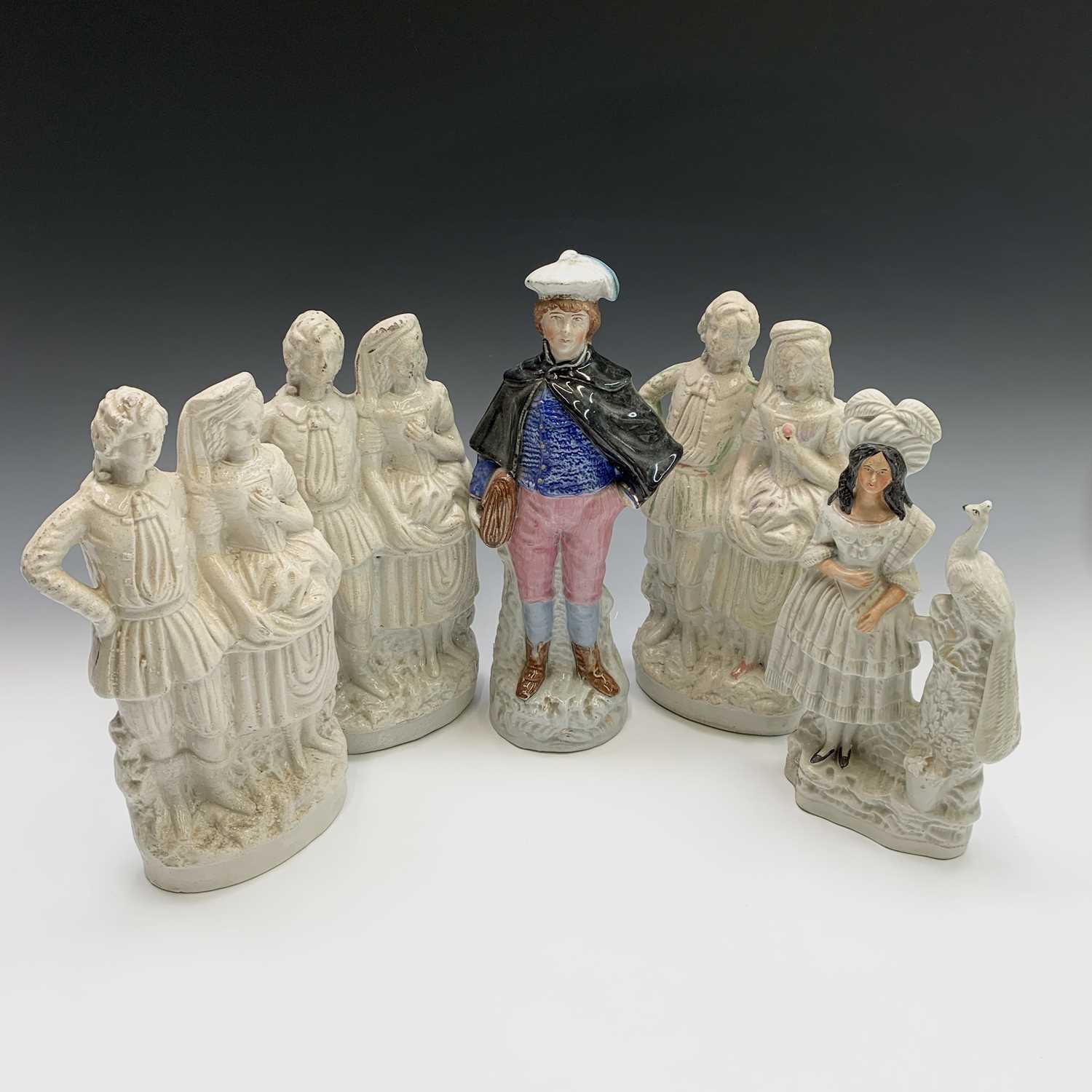 Lot 835 - Two Staffordshire portrait figures and three