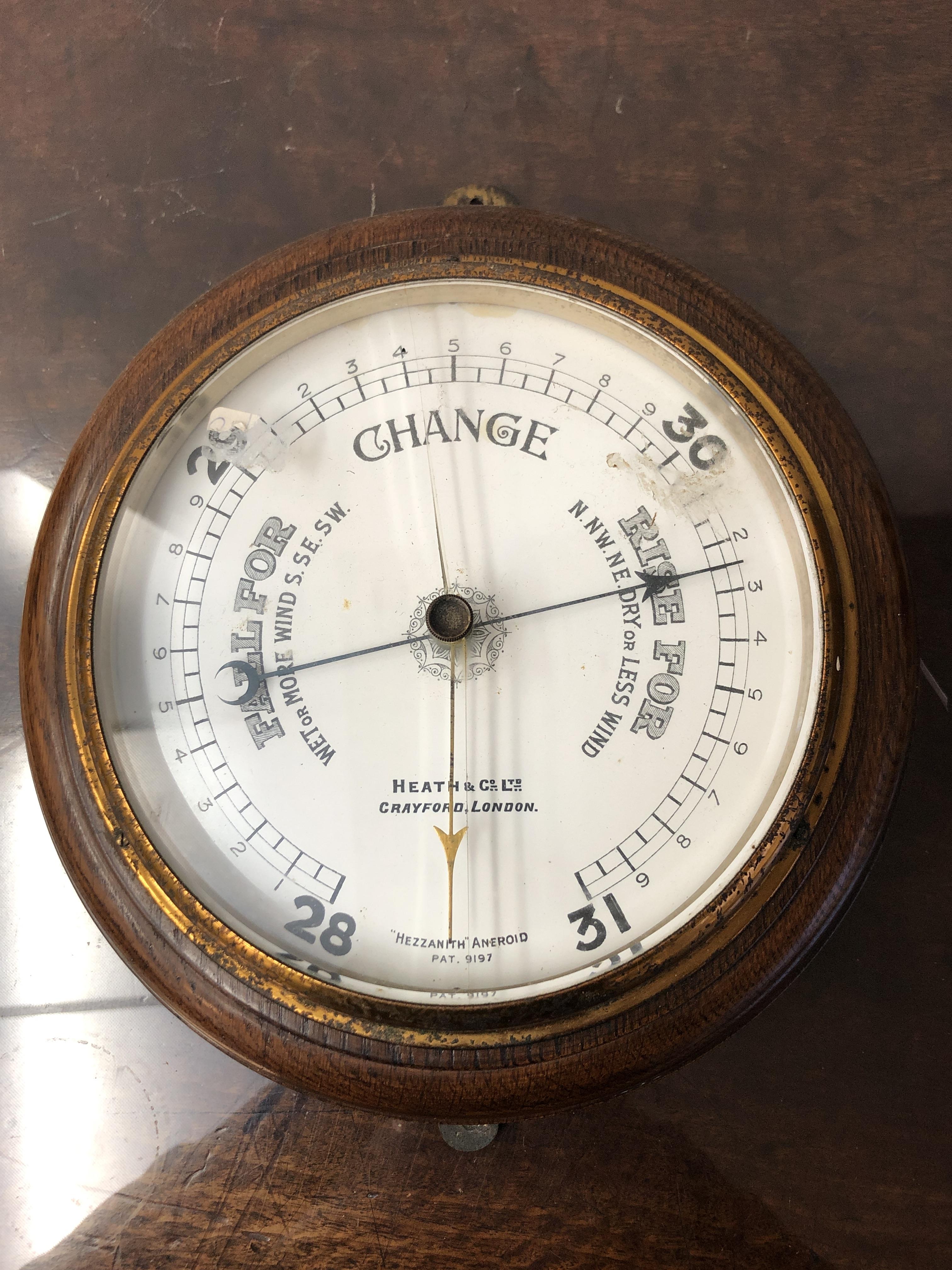 Lot 28 - An aneroid barometer retailed by Scott,