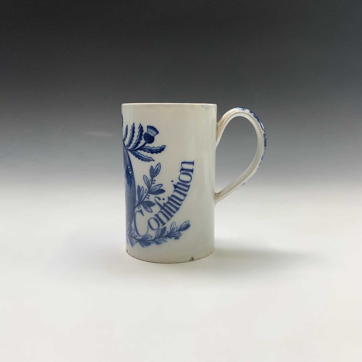 Lot 801 - An 18th century pearlware mug, transfer