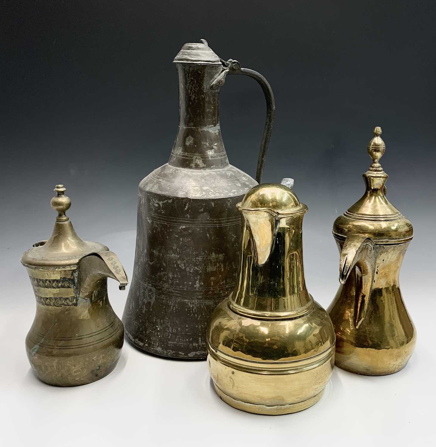 Lot 1000 - Two Saudi Arabian brass dallah pots, 19th
