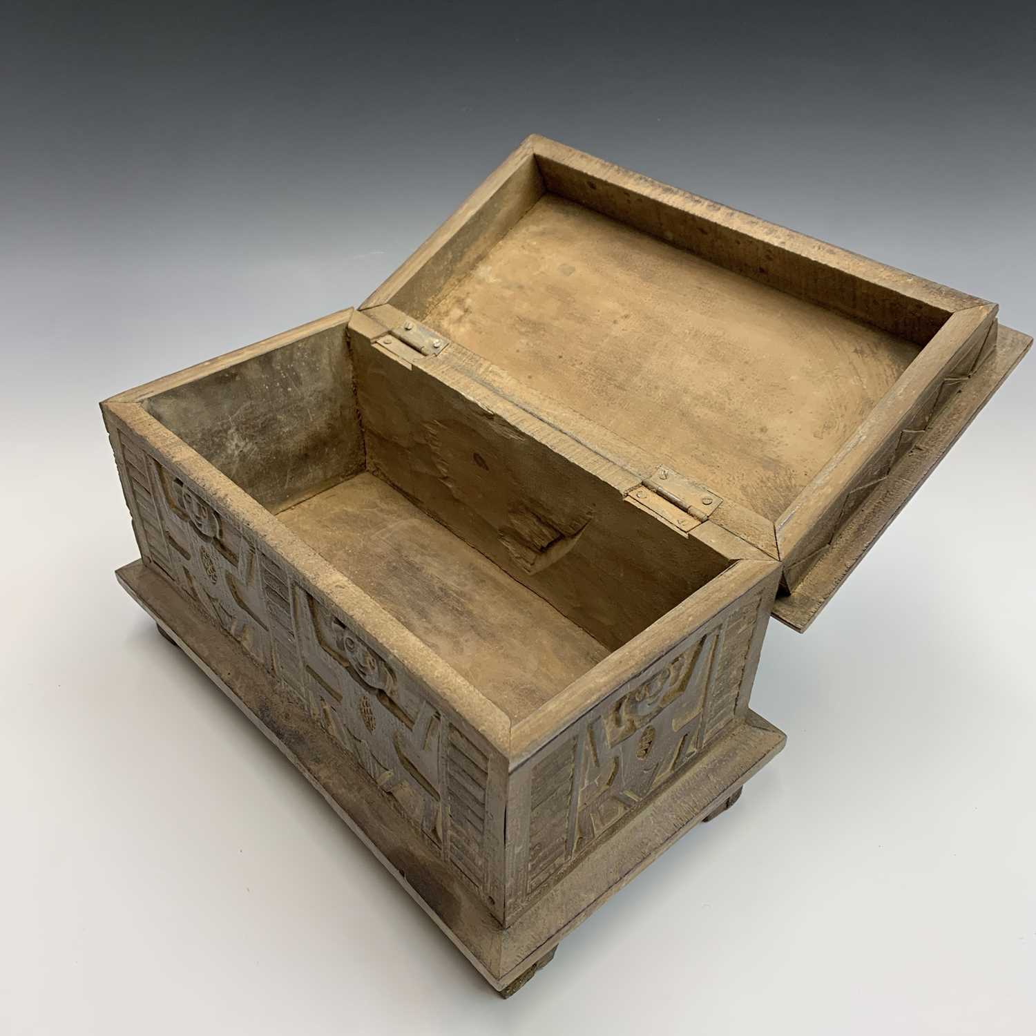 Lot 45 - An African carved wood box with figural and