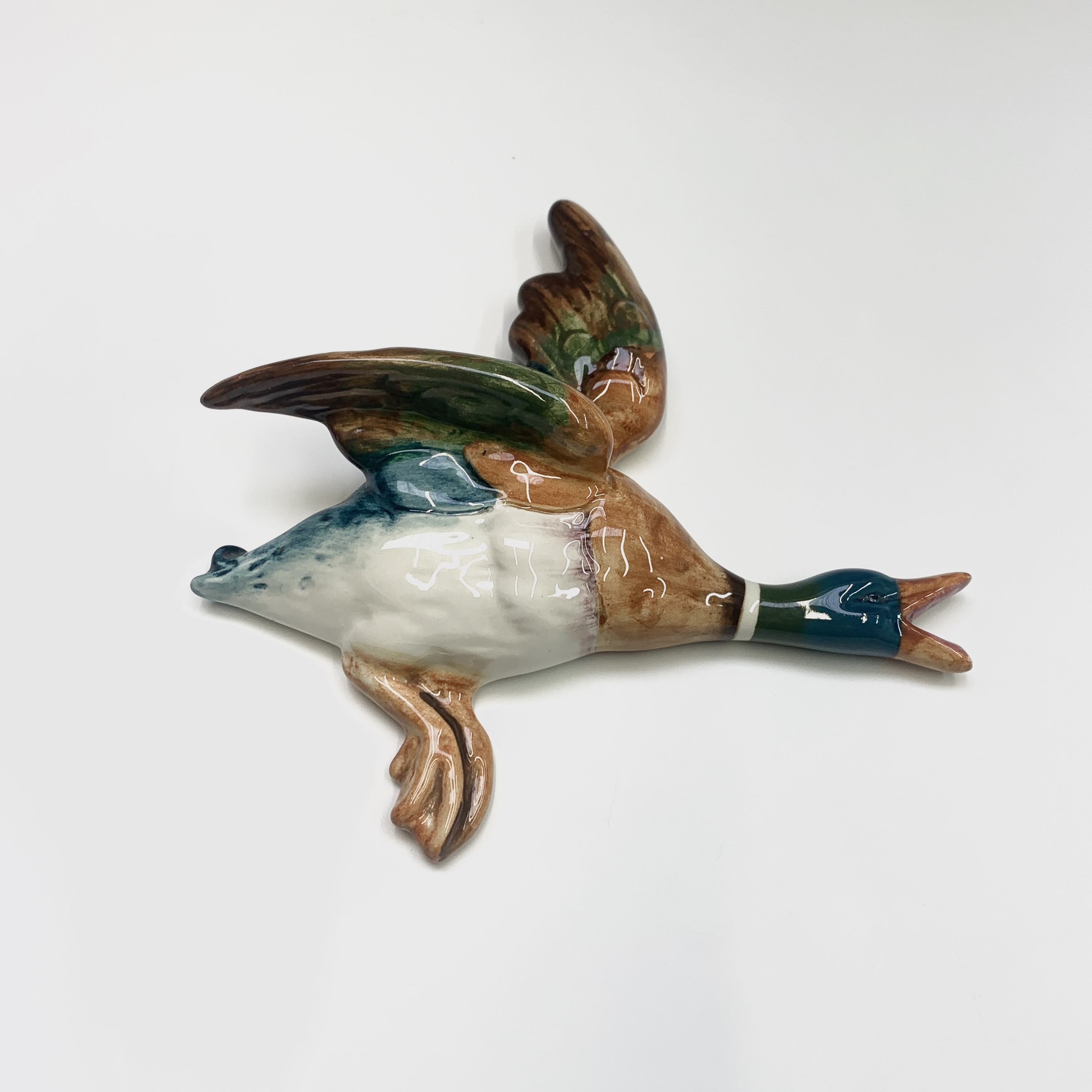 Lot 937 - A set of three graduated Beswick flying duck