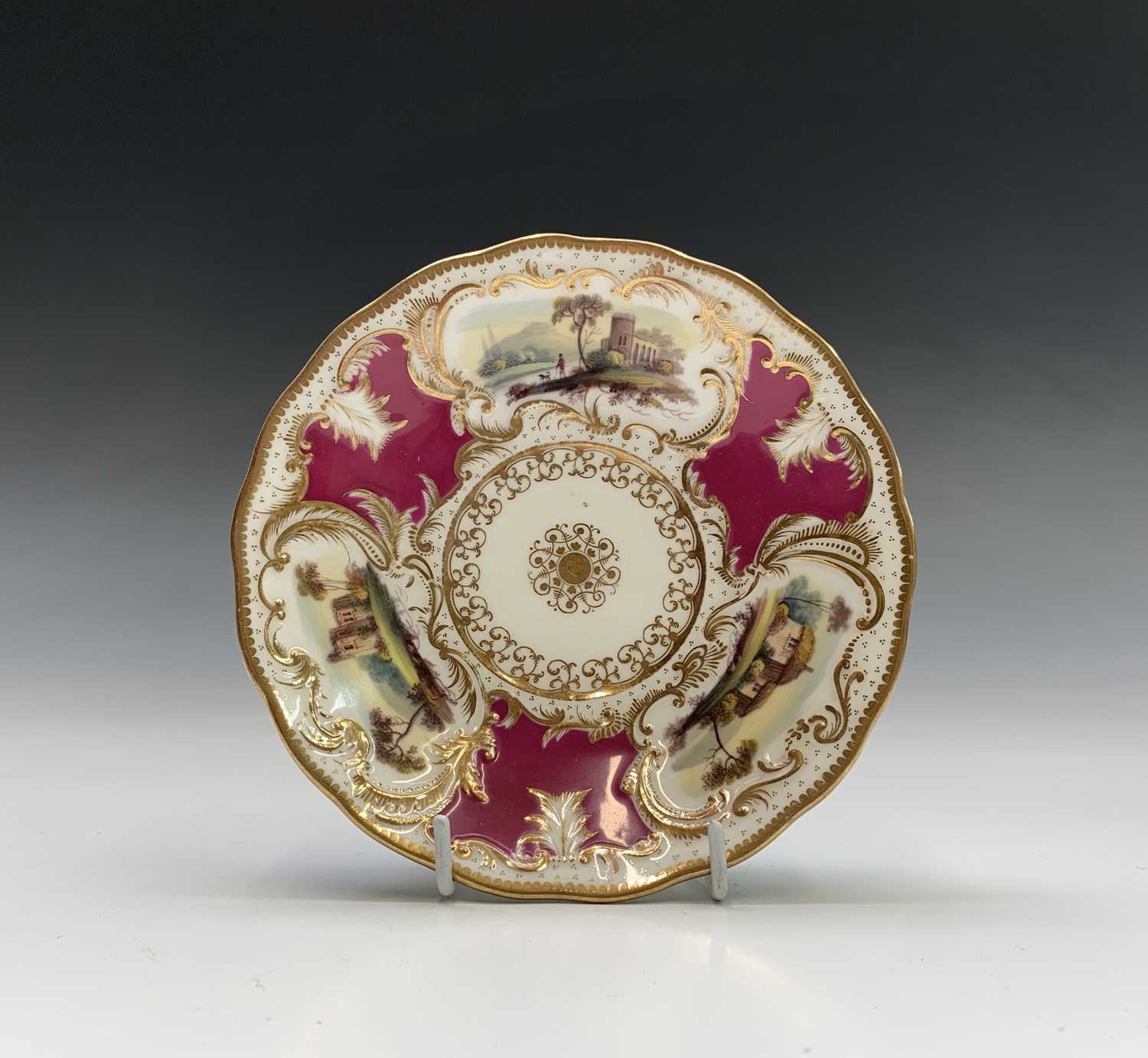 Lot 857 - A Minton porcelain trio, painted with