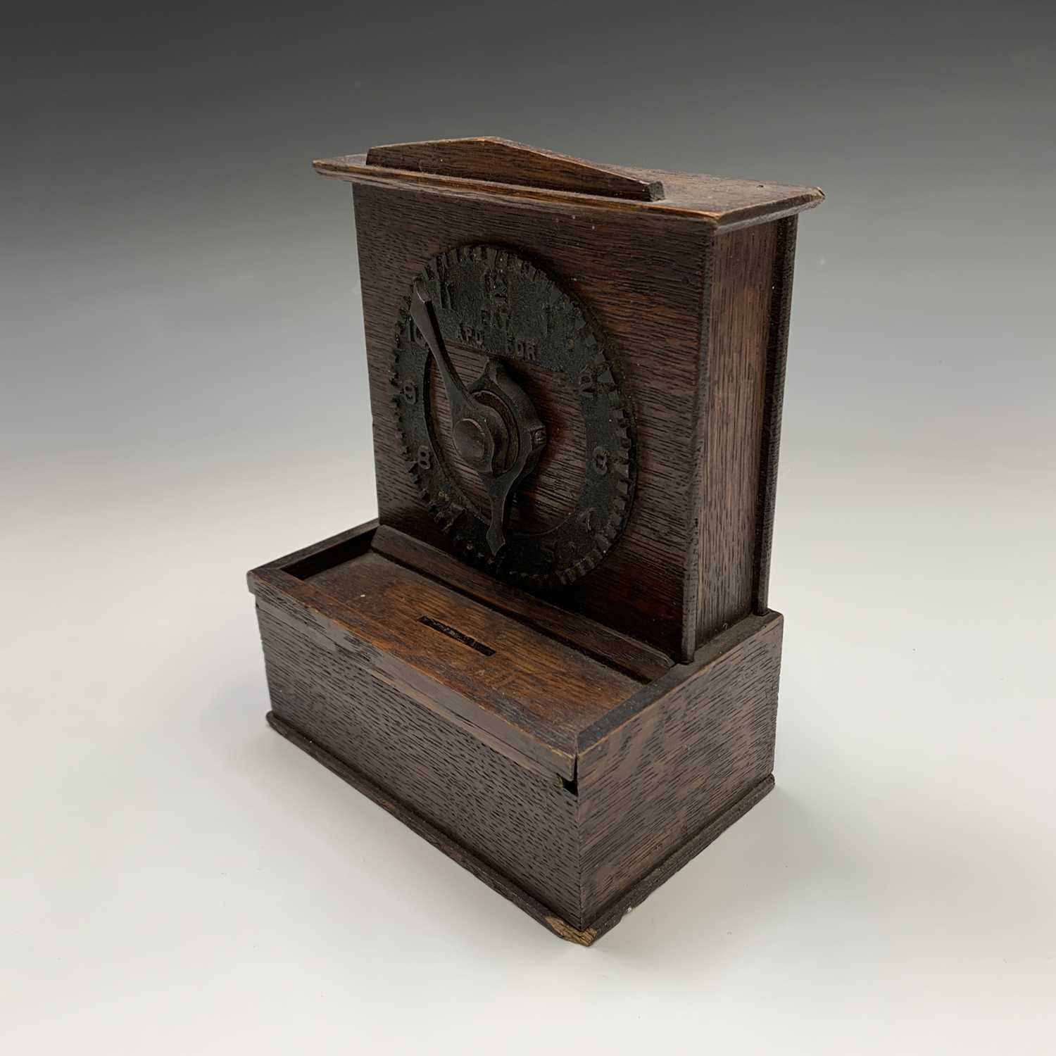 Lot 119 - An unusual oak money box, circa 1920, with