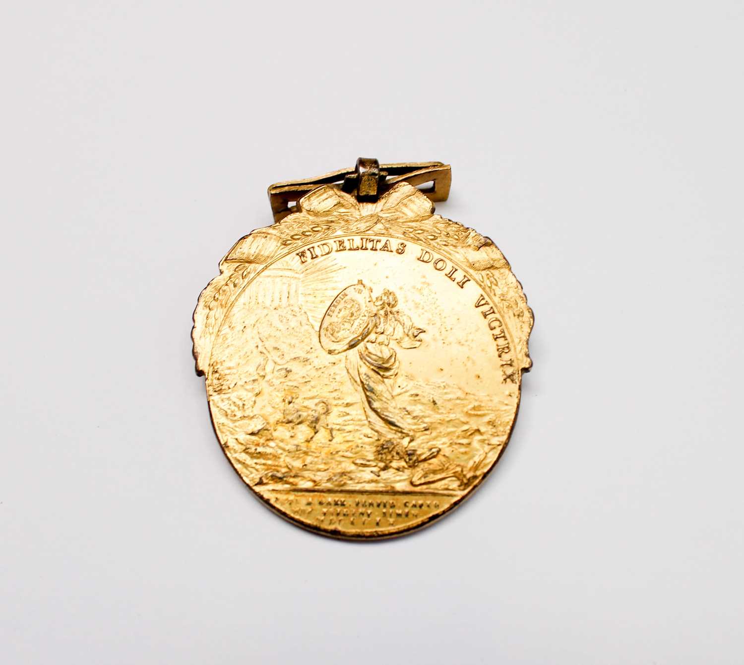 Lot 271 - MEDAL. A gilded medal featuring Ferdinard