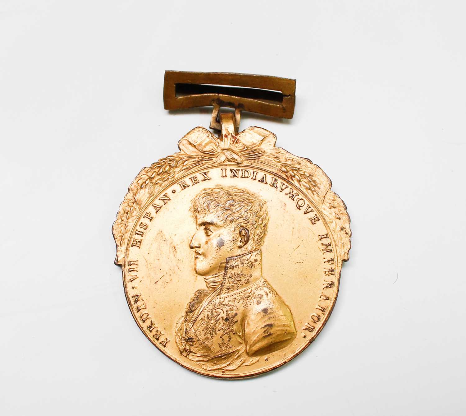 Lot 271 - MEDAL. A gilded medal featuring Ferdinard