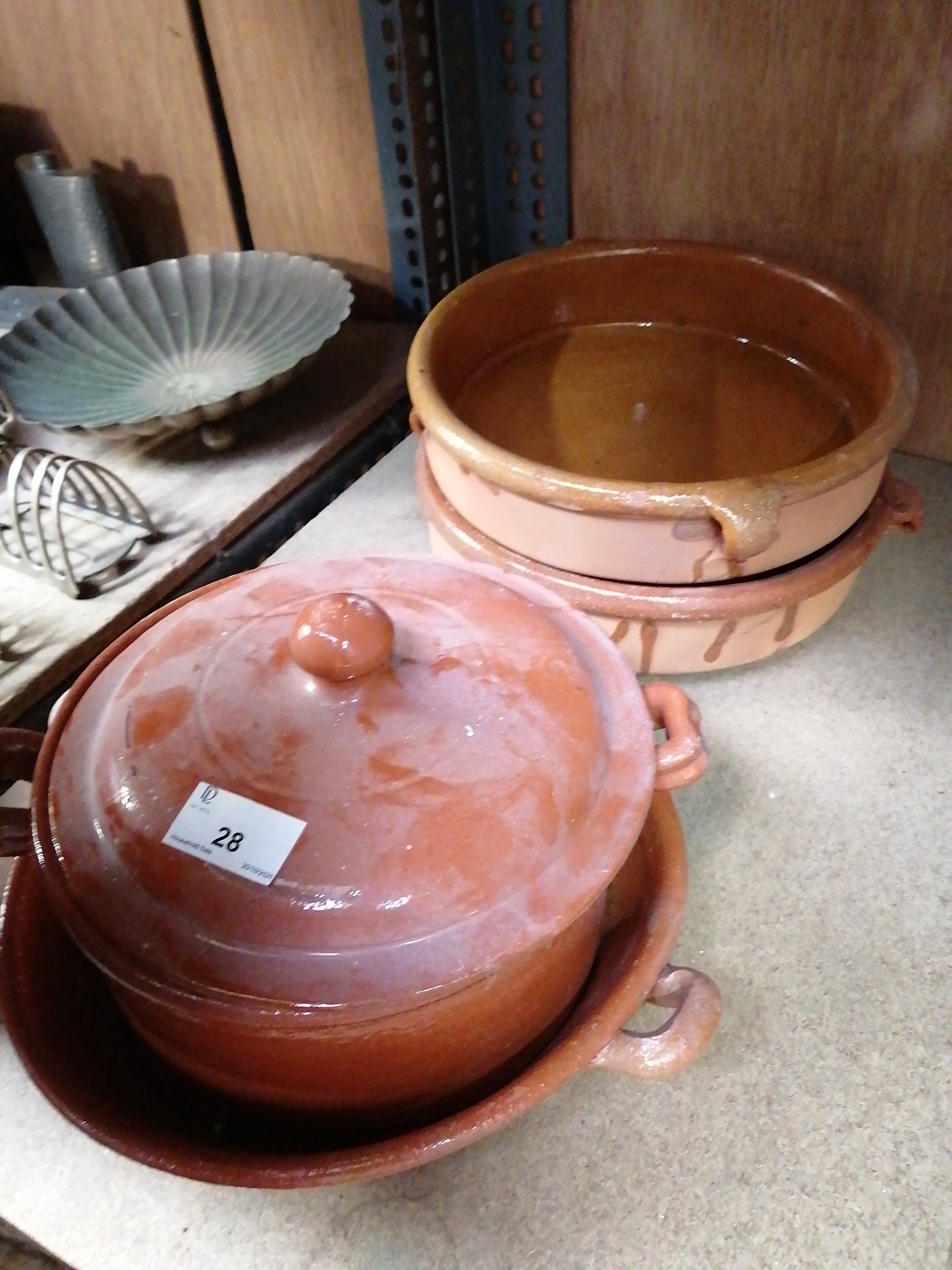 Lot 28 - Earthenware cooking pot and dishes.