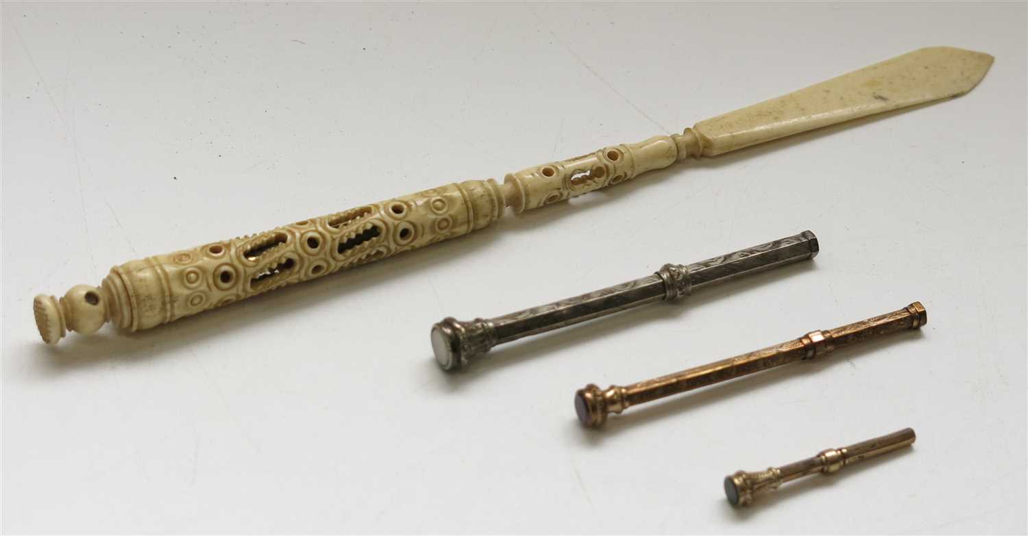 Lot 2532 - A paper knife/dip pen in bone with pierced