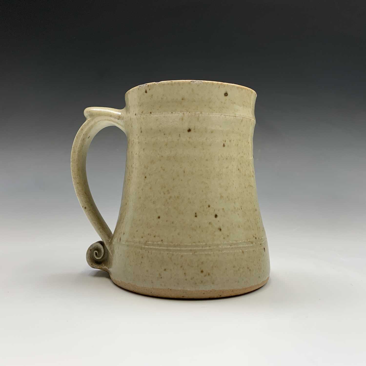 Lot 1083 - A Leach studio pottery mug, the handle with