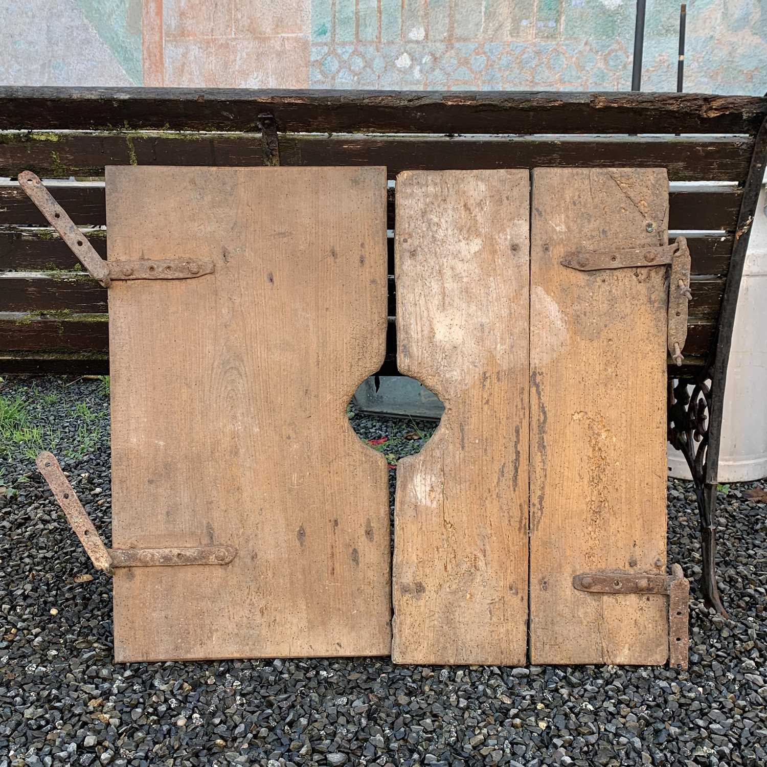 Lot 567 - A pair of 19th century elm mill doors with