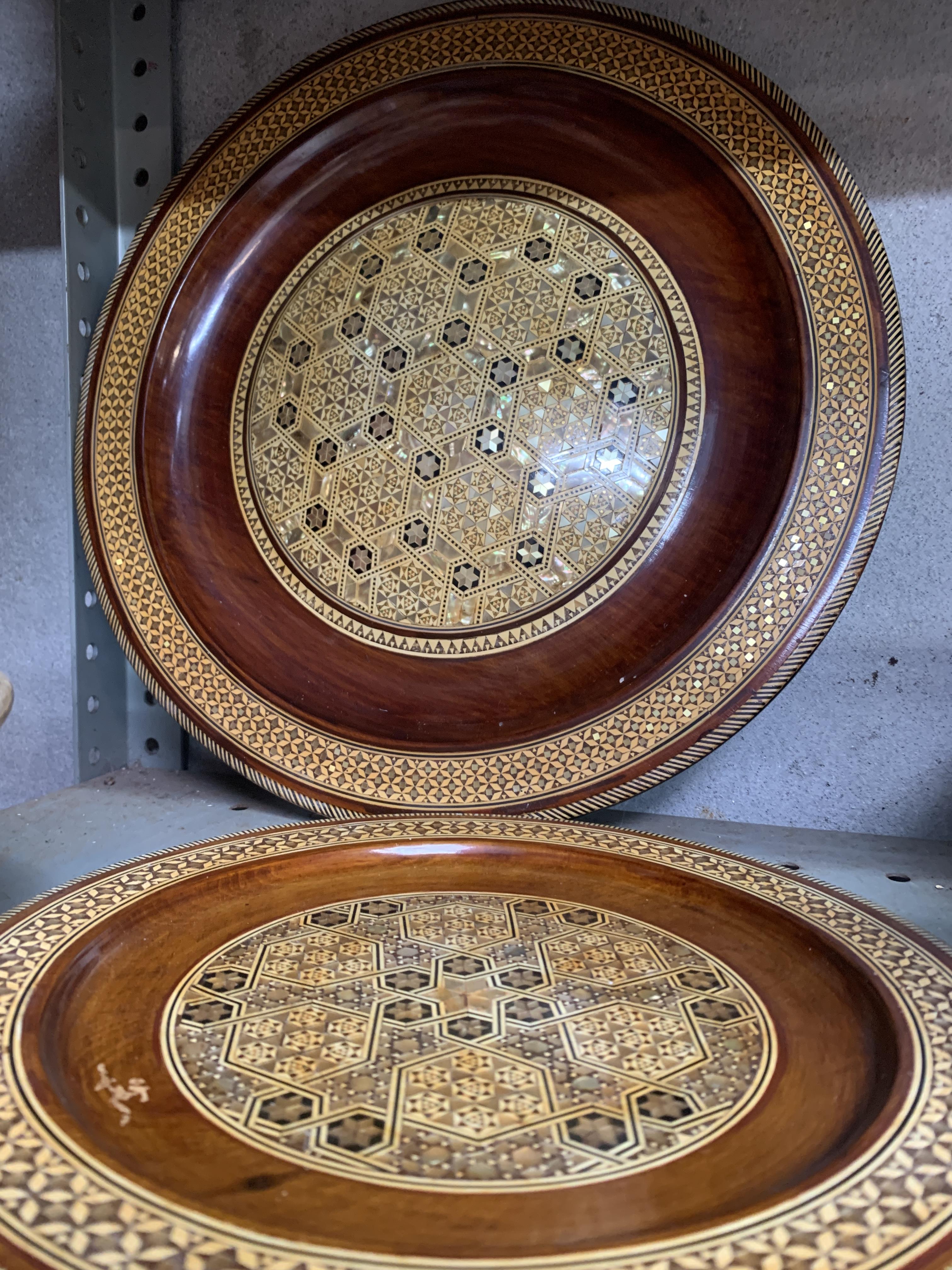 Lot 41 - Two wooden North African plates, a tankard