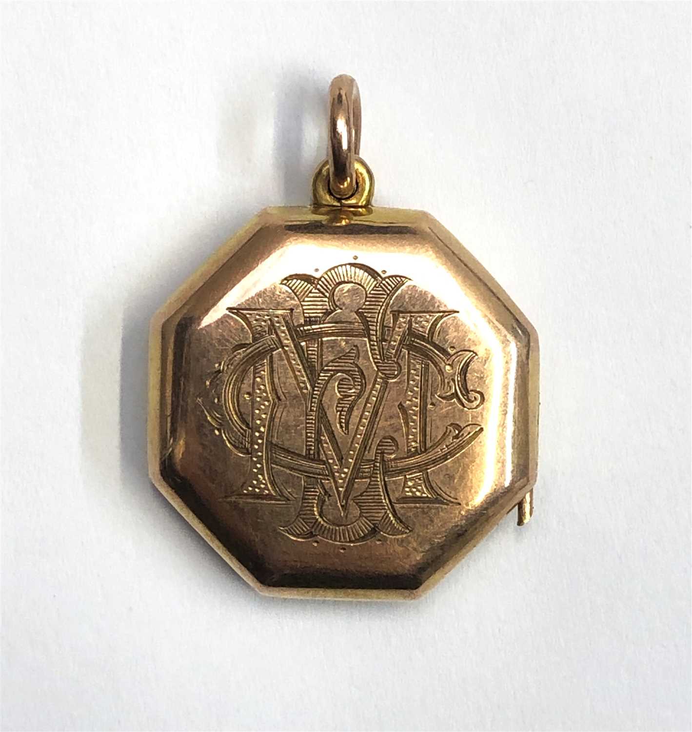 Lot 2462 - A 10ct gold Edwardian octagonal locket.