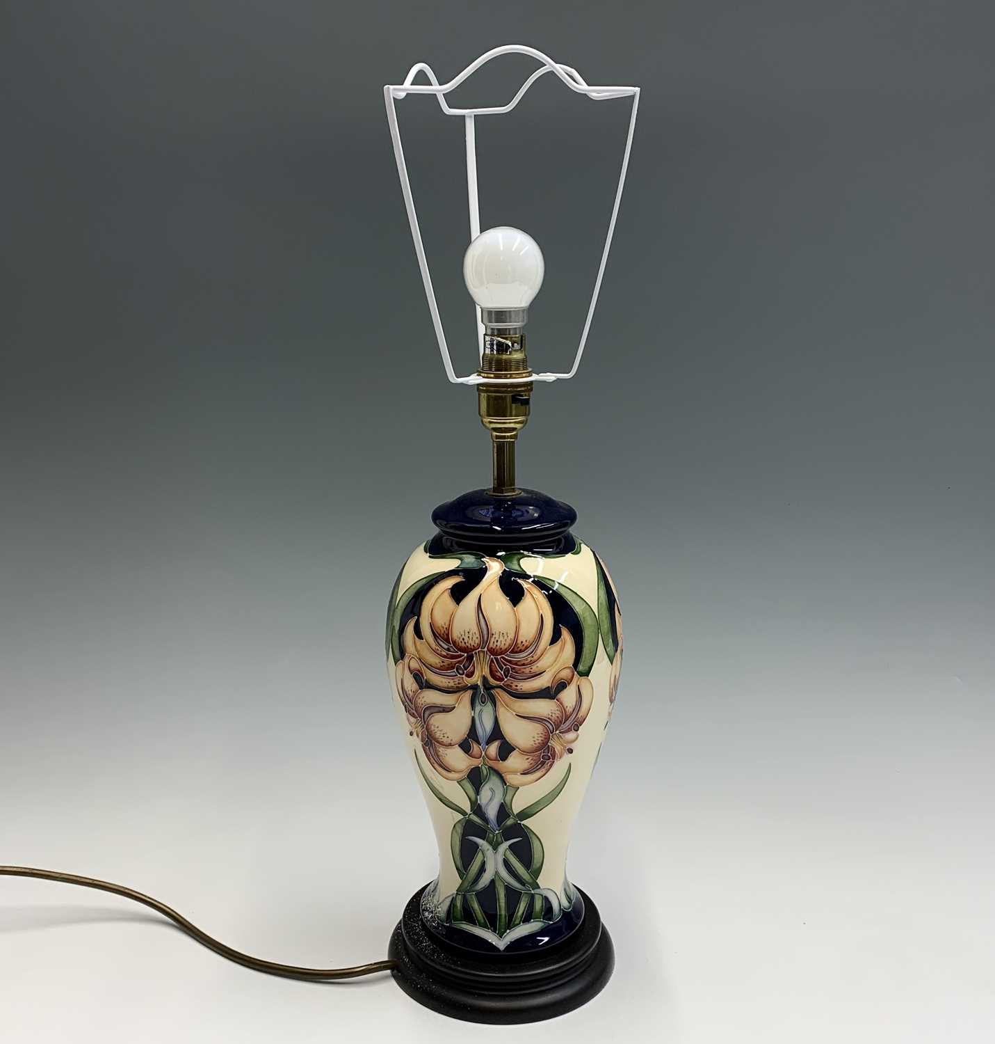 Lot 819 - A Moorcroft 'Sweet Lily' pattern table lamp.