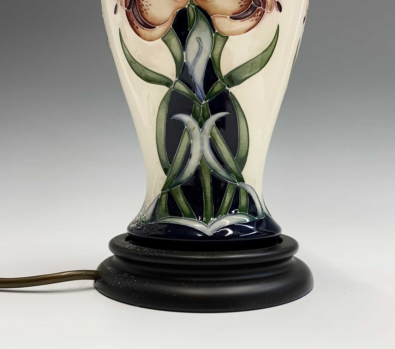 Lot 819 - A Moorcroft 'Sweet Lily' pattern table lamp.