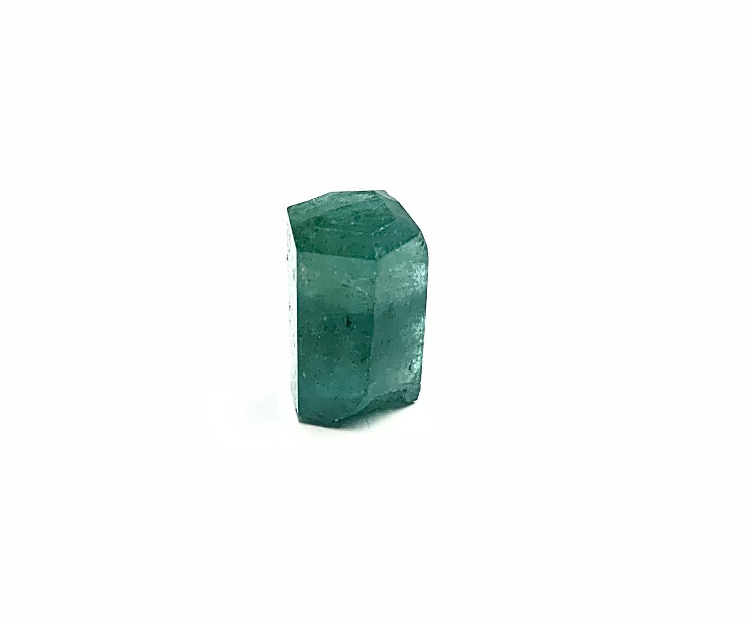 Lot 733 - A small column of faceted emerald,