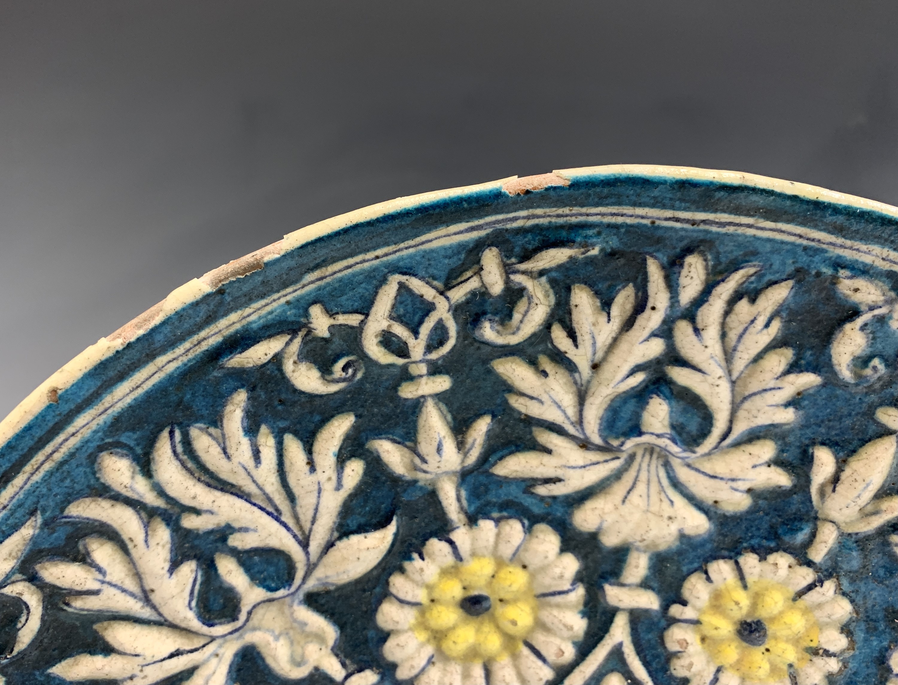 Lot 848 - A Middle Eastern pottery plate, probably