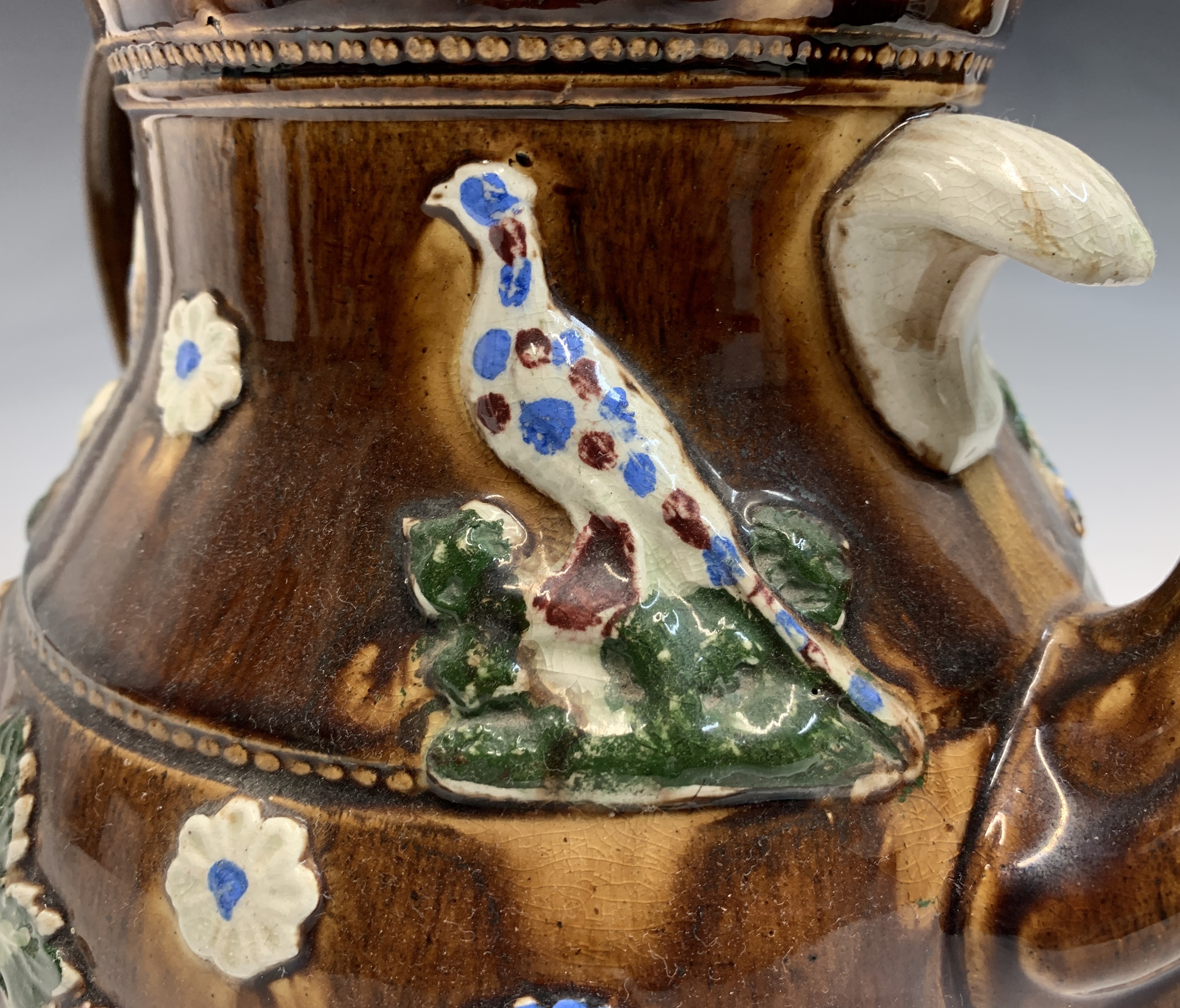 Lot 830 - A Victorian Measham treacle glazed bargeware