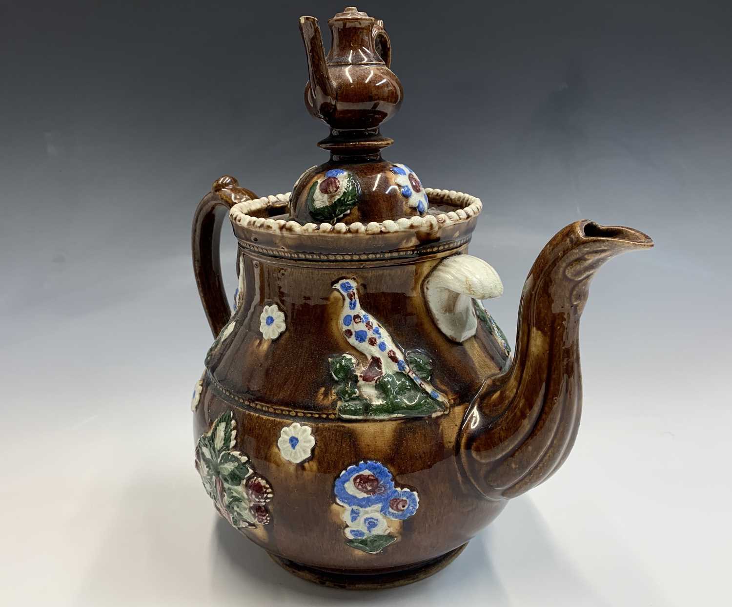 Lot 830 - A Victorian Measham treacle glazed bargeware