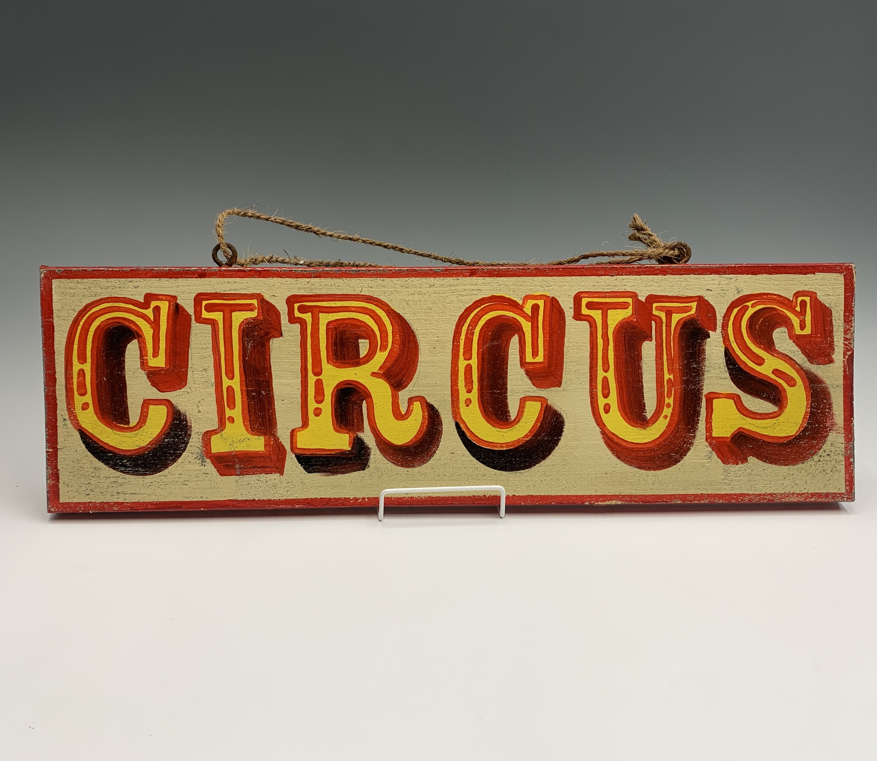 Lot 132 - A signwritten wooden sign 'CIRCUS', having