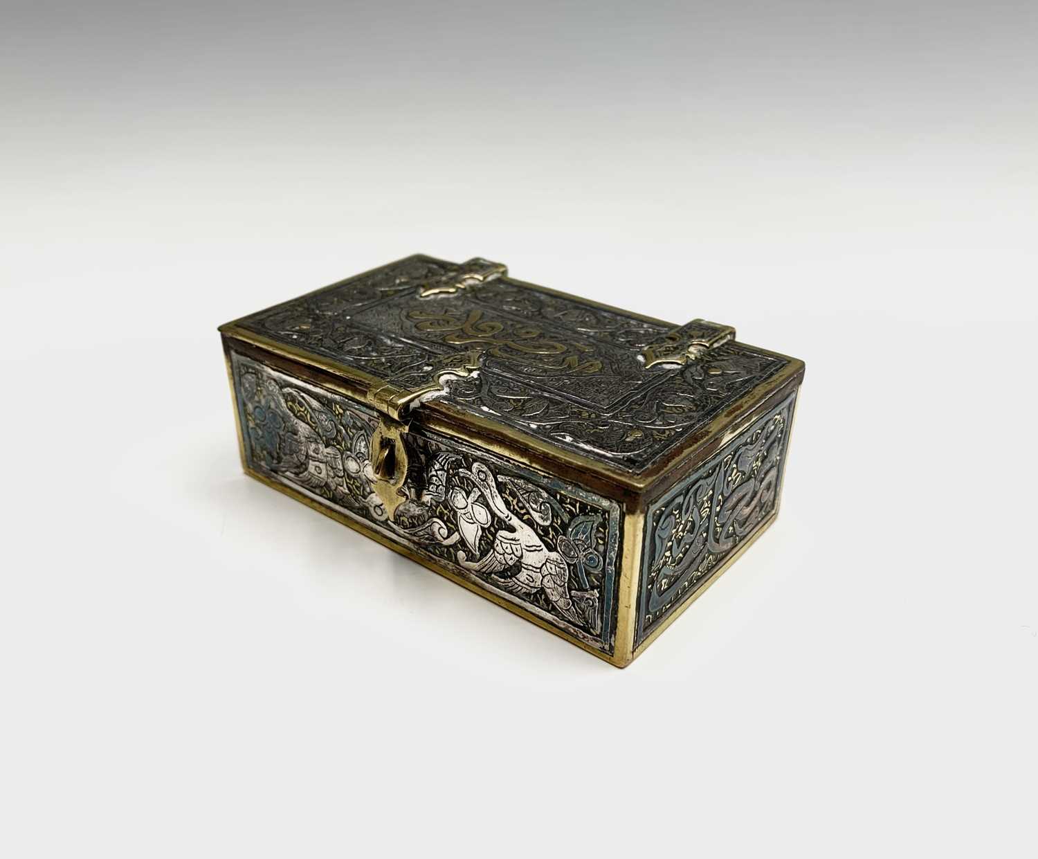 Lot 1038 - A Cairoware brass and silver inlaid box,