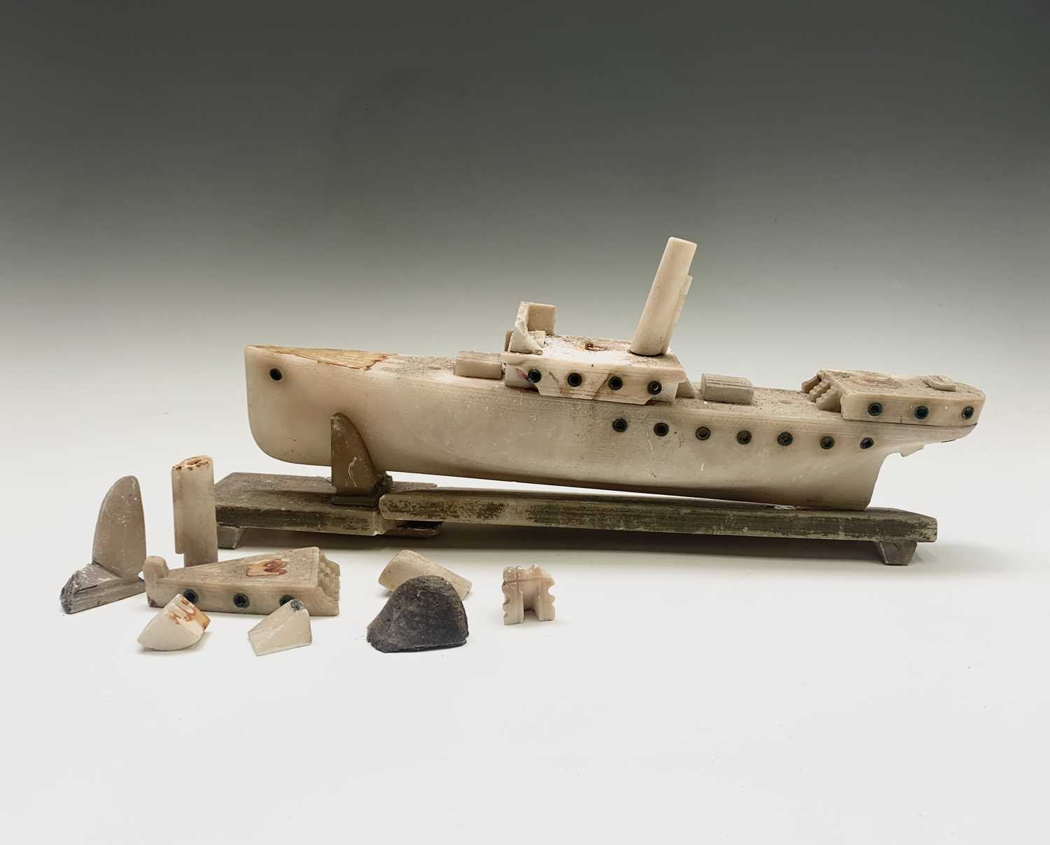 Lot 224 - An alabaster model of a steamship, on a