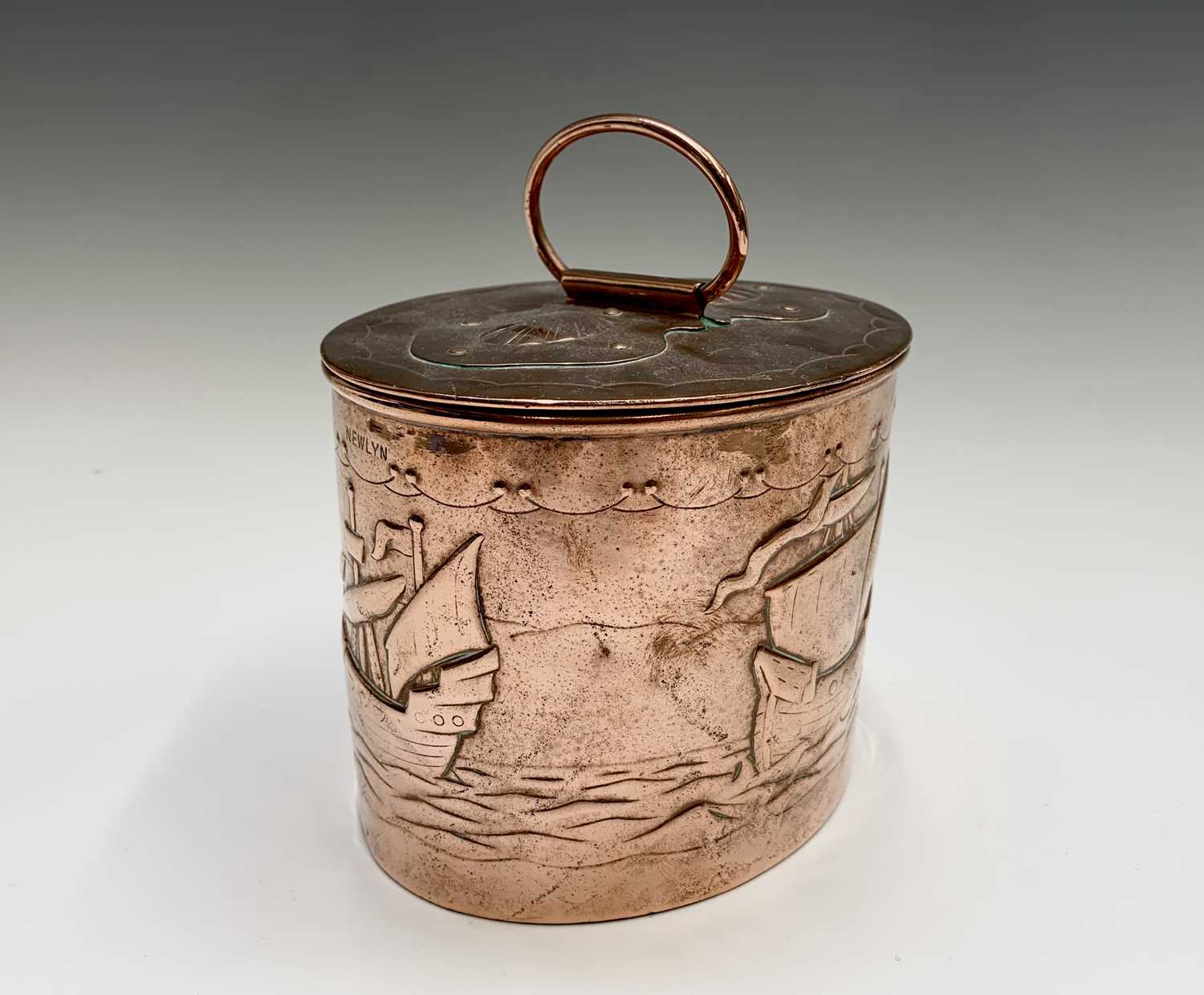 Lot 297 - A Newlyn copper oval tea caddy, the pull off